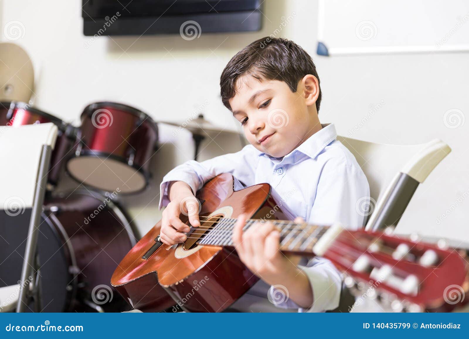 Talented Student Practicing Guitar Stock Image - Image of student ...