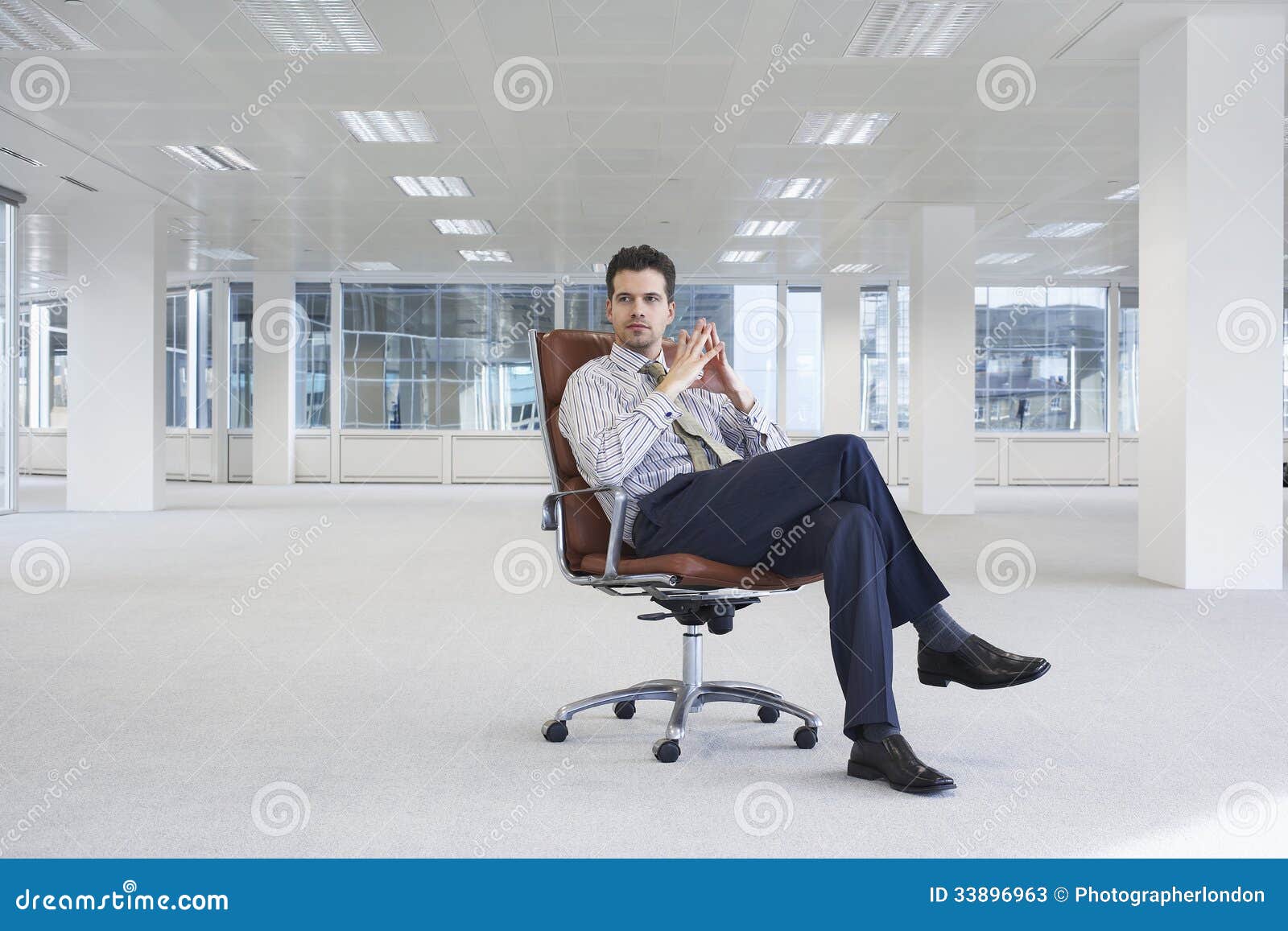Confident Businessman on Chair in New Office Stock Image - Image of ... Confident Businessman on Chair in New Office Stock Image - Image of ...