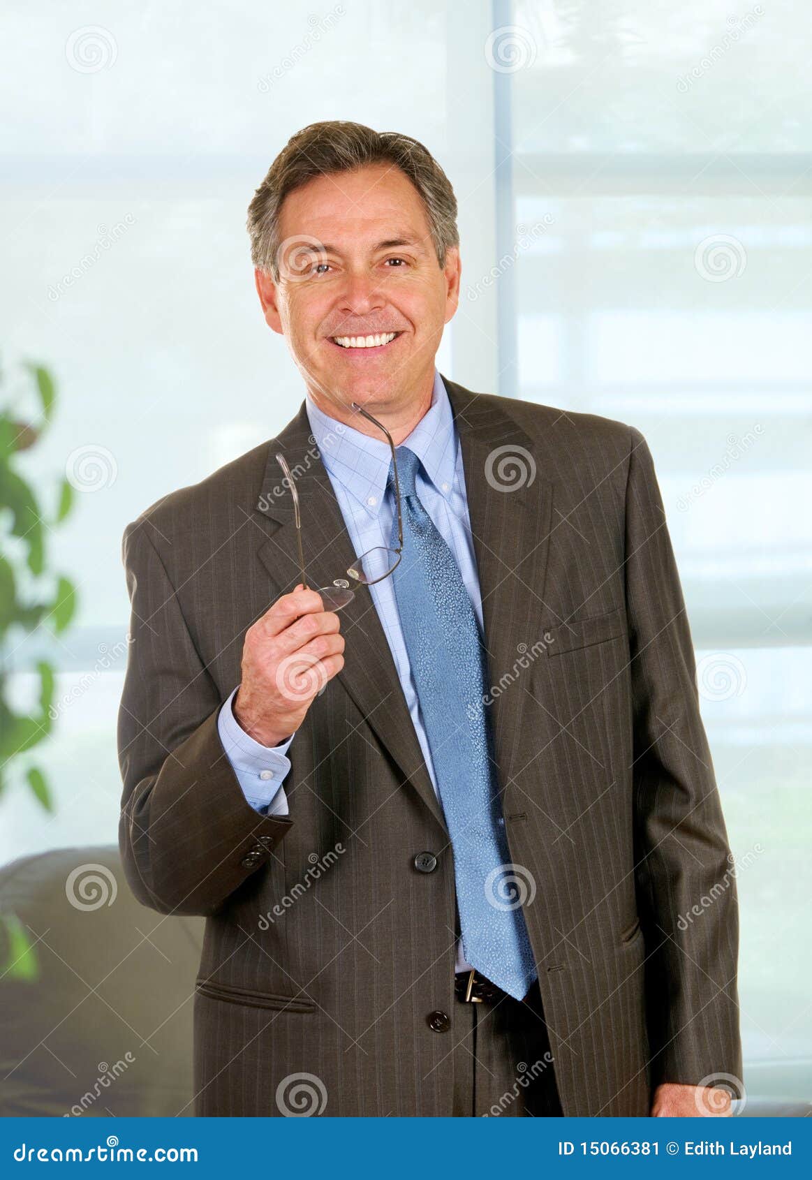 Confident Businessman in Corner Office Stock Image - Image of cheerful ...