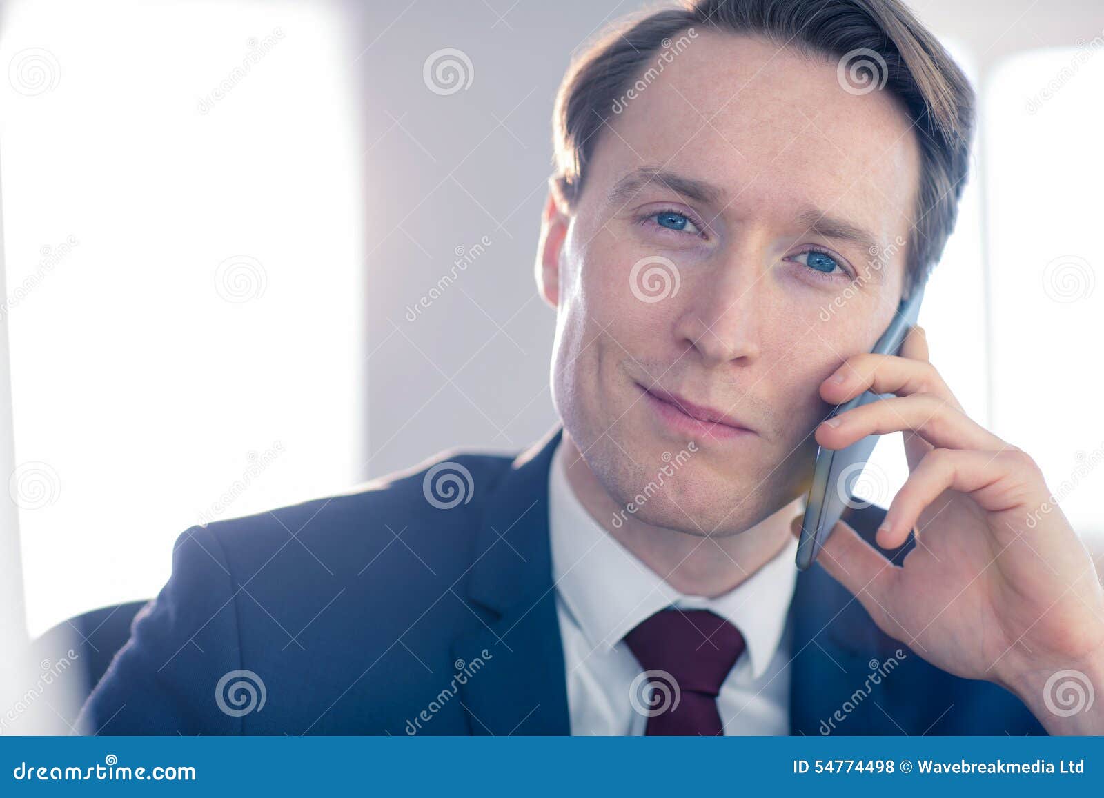 Confident Businessman Looking at Camera while Having a Phone Call Stock ...