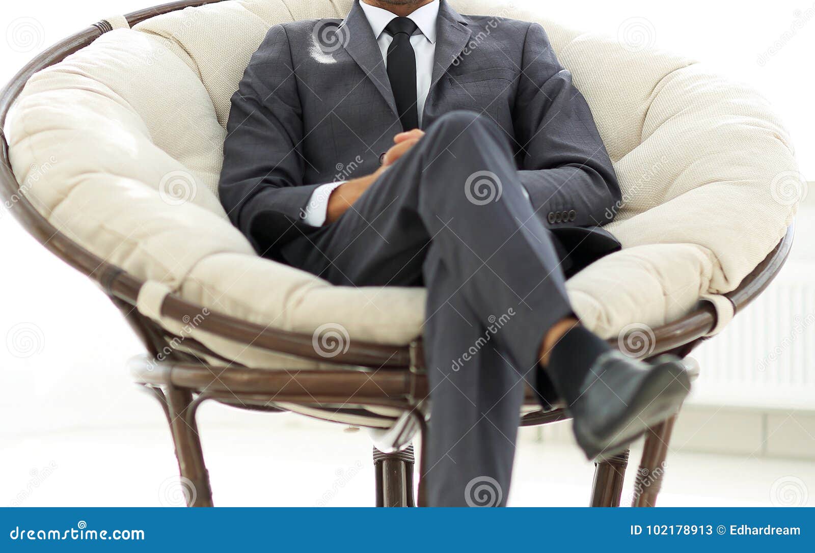 Confident Businessman Sitting in a Large Comfortable Chair. Stock Image ... Confident Businessman Sitting in a Large Comfortable Chair. Stock Image ...