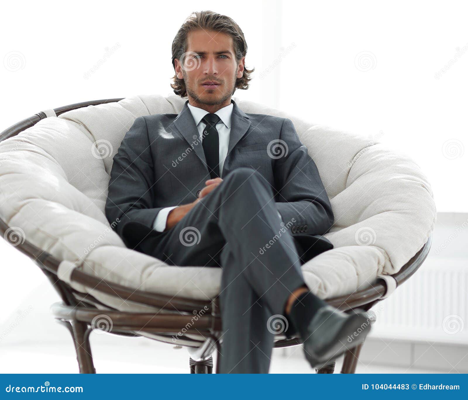 Confident Businessman Sitting in a Large Comfortable Chair. Stock Image ... Confident Businessman Sitting in a Large Comfortable Chair. Stock Image ...