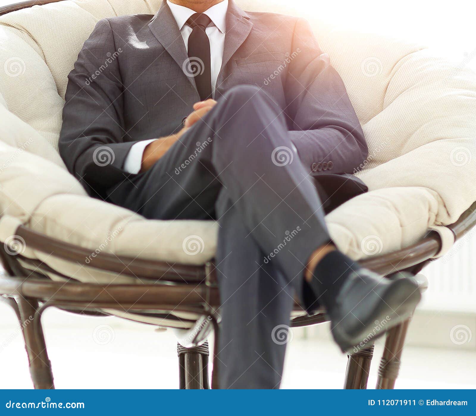 Confident Businessman Sitting in a Large Comfortable Chair. Stock Image ... Confident Businessman Sitting in a Large Comfortable Chair. Stock Image ...