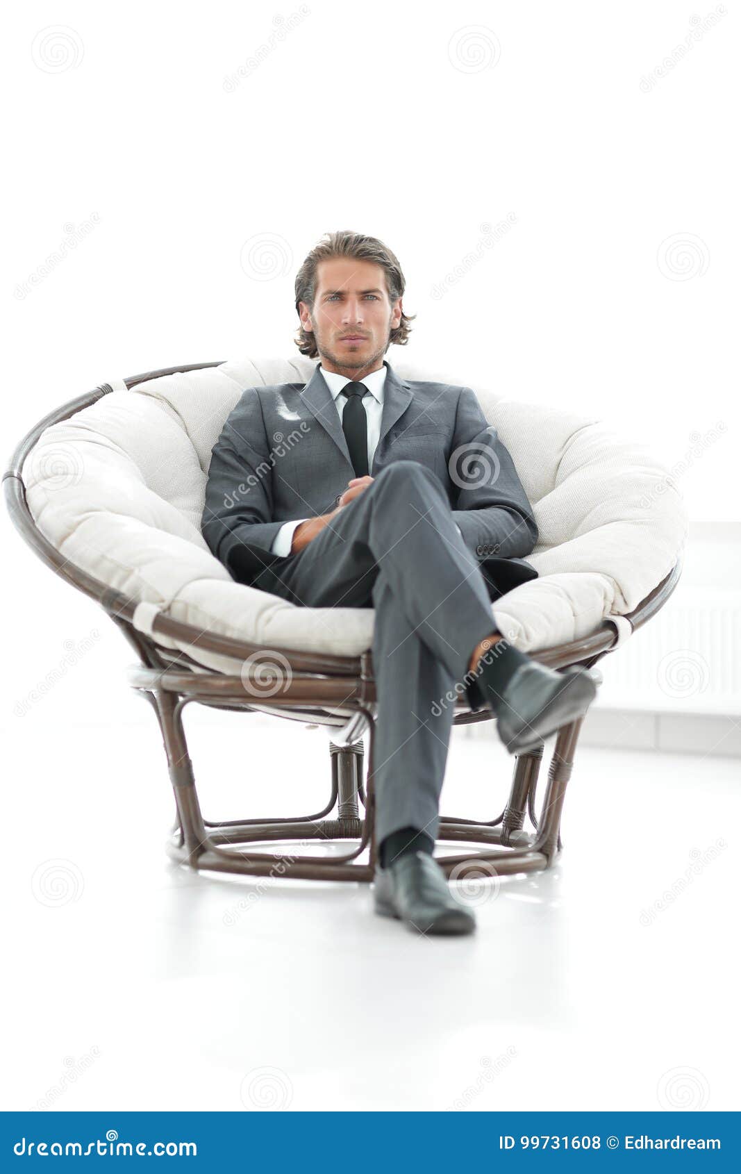 Confident Businessman Sitting in a Large Comfortable Chair. Stock Photo ... Confident Businessman Sitting in a Large Comfortable Chair. Stock Photo ...