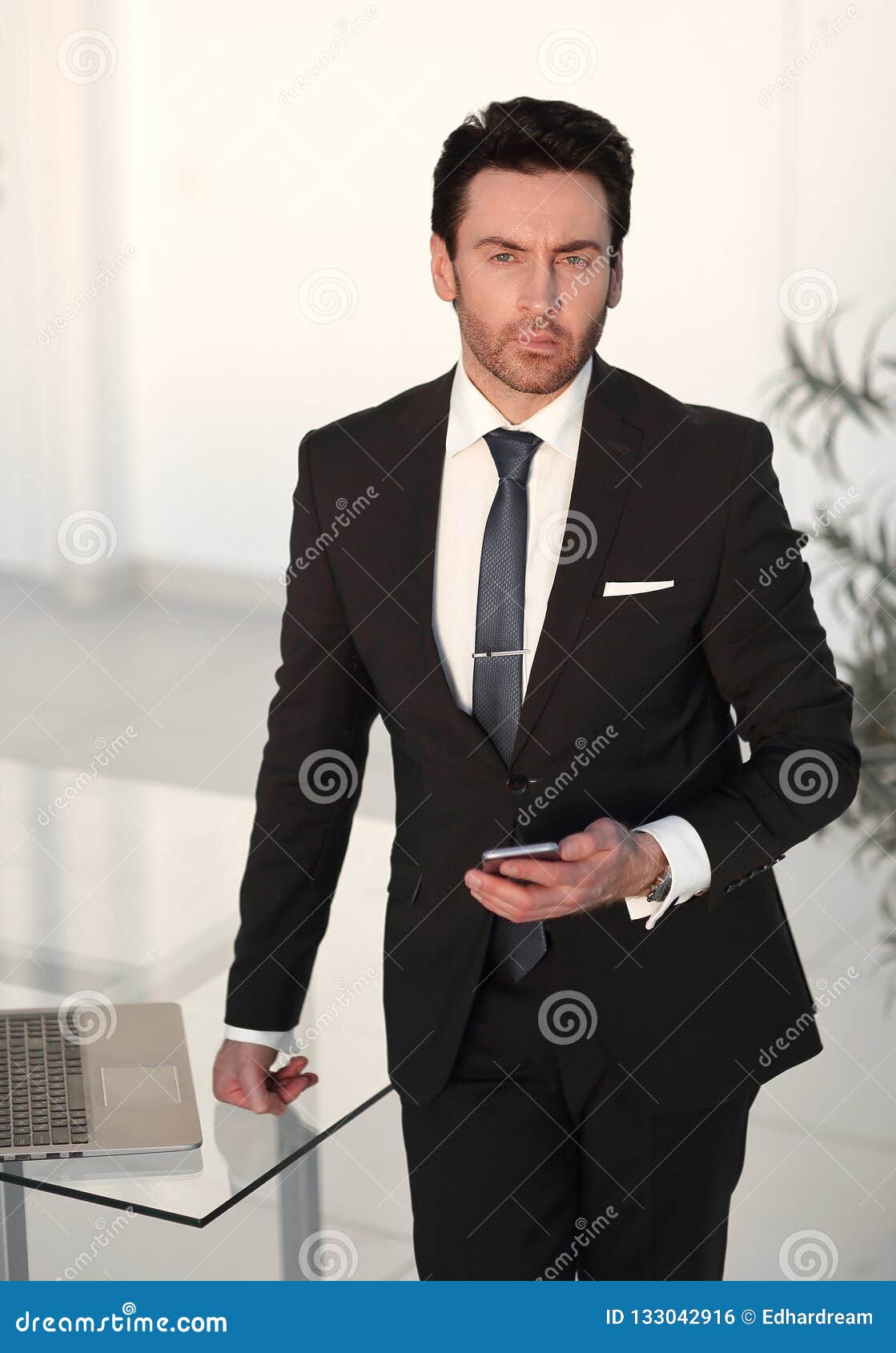 Confident Businessman Standing in the Office Stock Photo - Image of ... Confident Businessman Standing in the Office Stock Photo - Image of ...