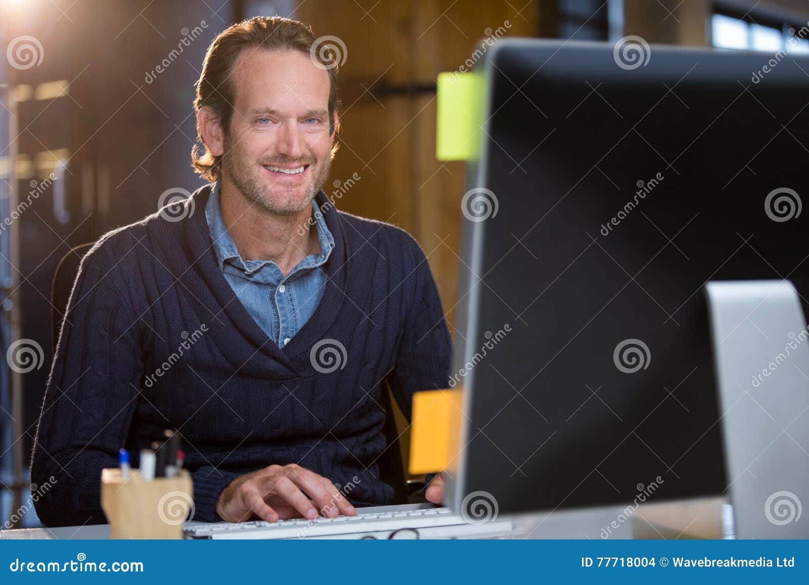 Confident Businessman Using Computer at Desk Stock Photo - Image of ...