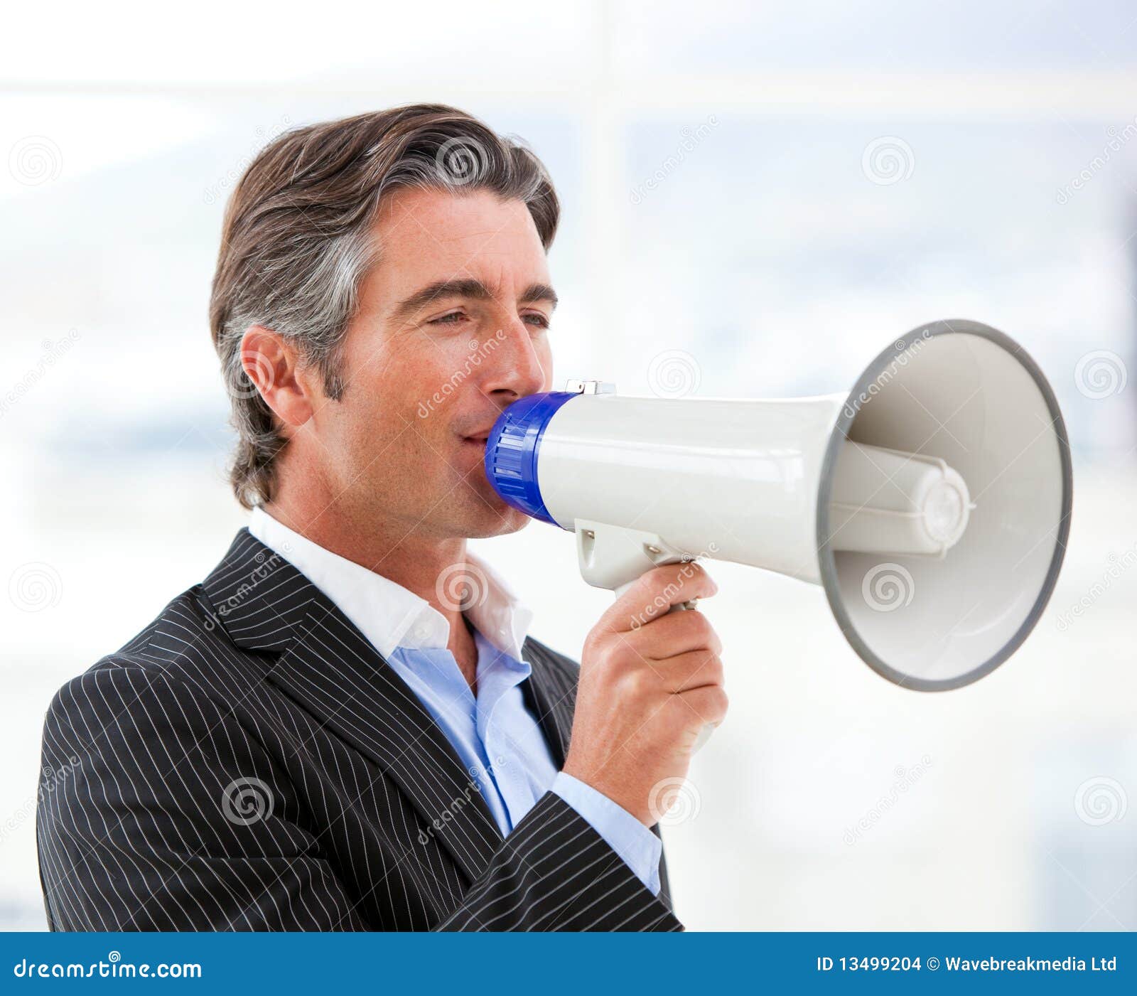 Confident Businessman Yelling through a Megaphone Stock Photo - Image ...