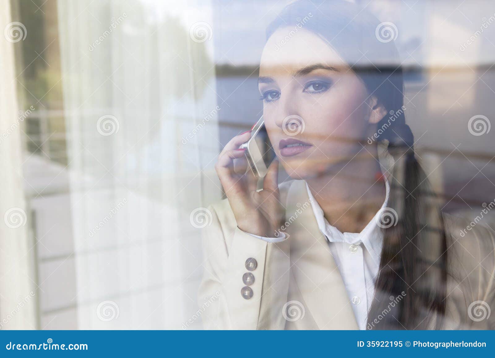 Confident Businesswoman Using Cell Phone in Office Stock Image - Image ...