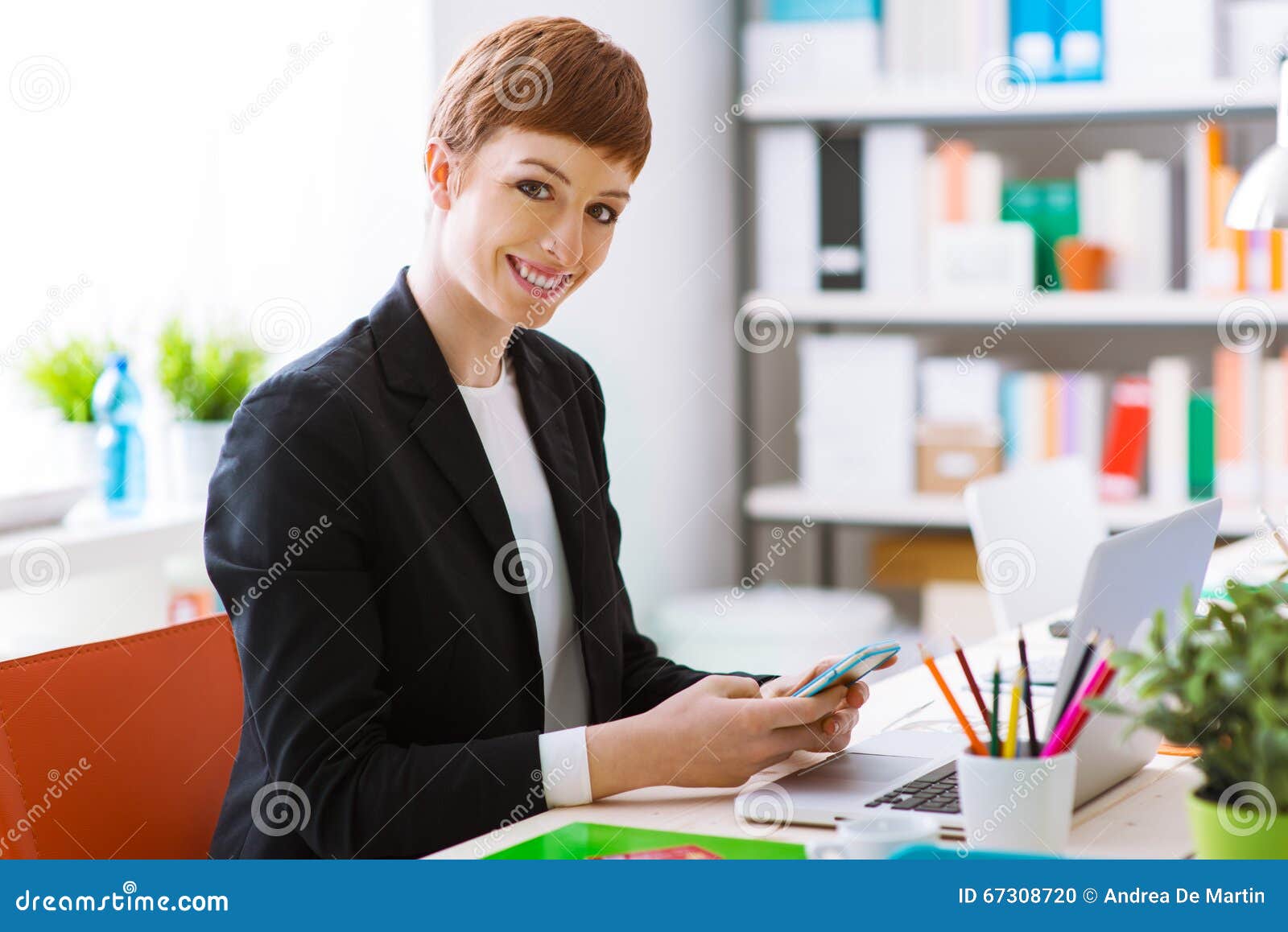 Confident Businesswoman Using a Smart Phone Stock Photo - Image of ...