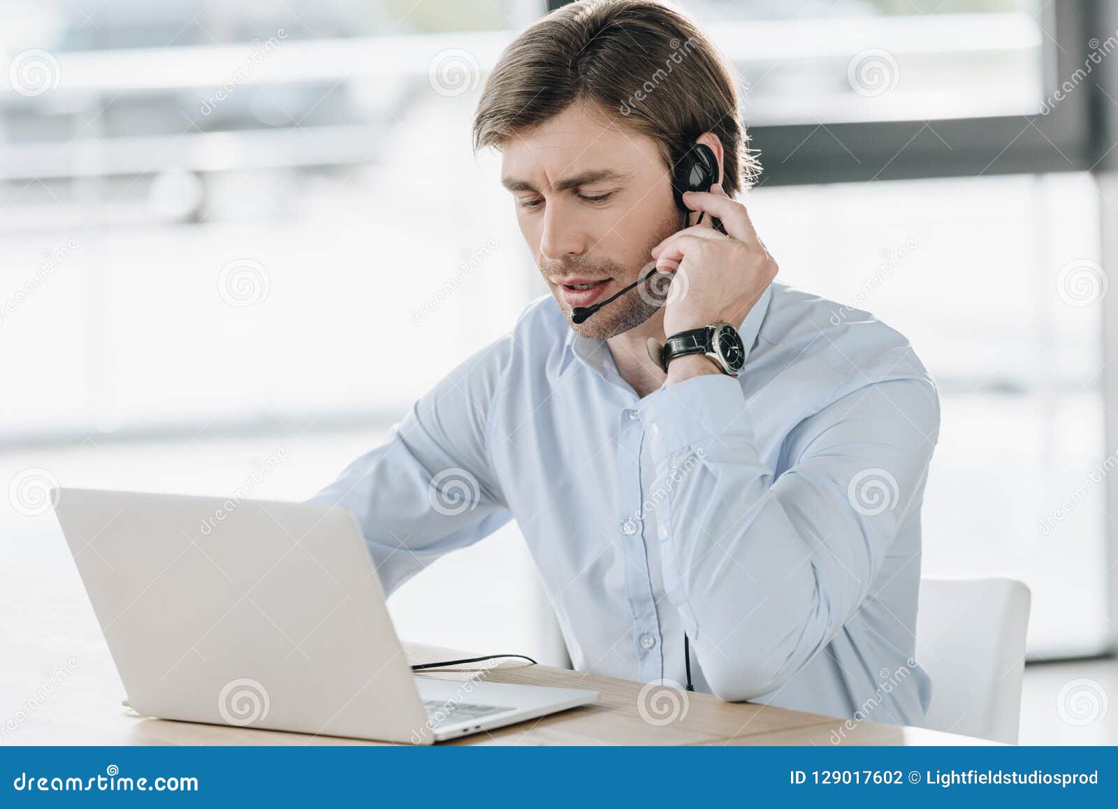 Confident Call Center Worker with Laptop Sitting Stock Photo - Image of ...