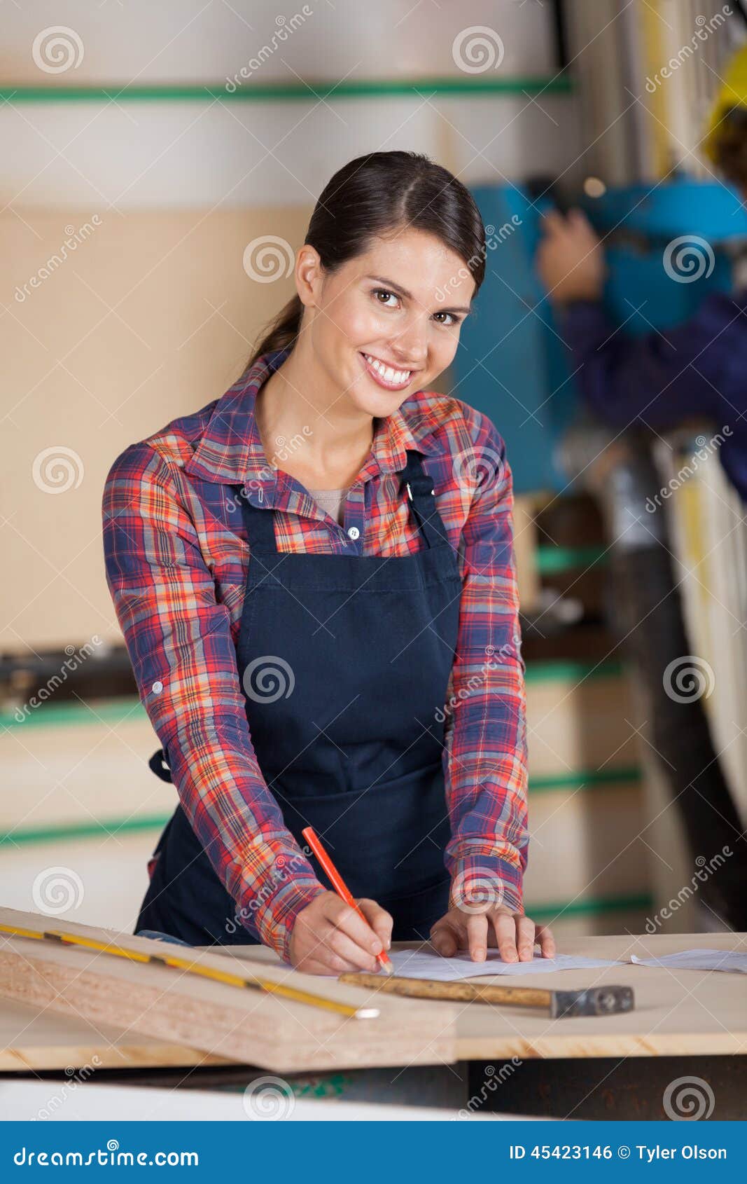 Confident Carpenter Writing on Paper in Workshop Stock Photo - Image of ...
