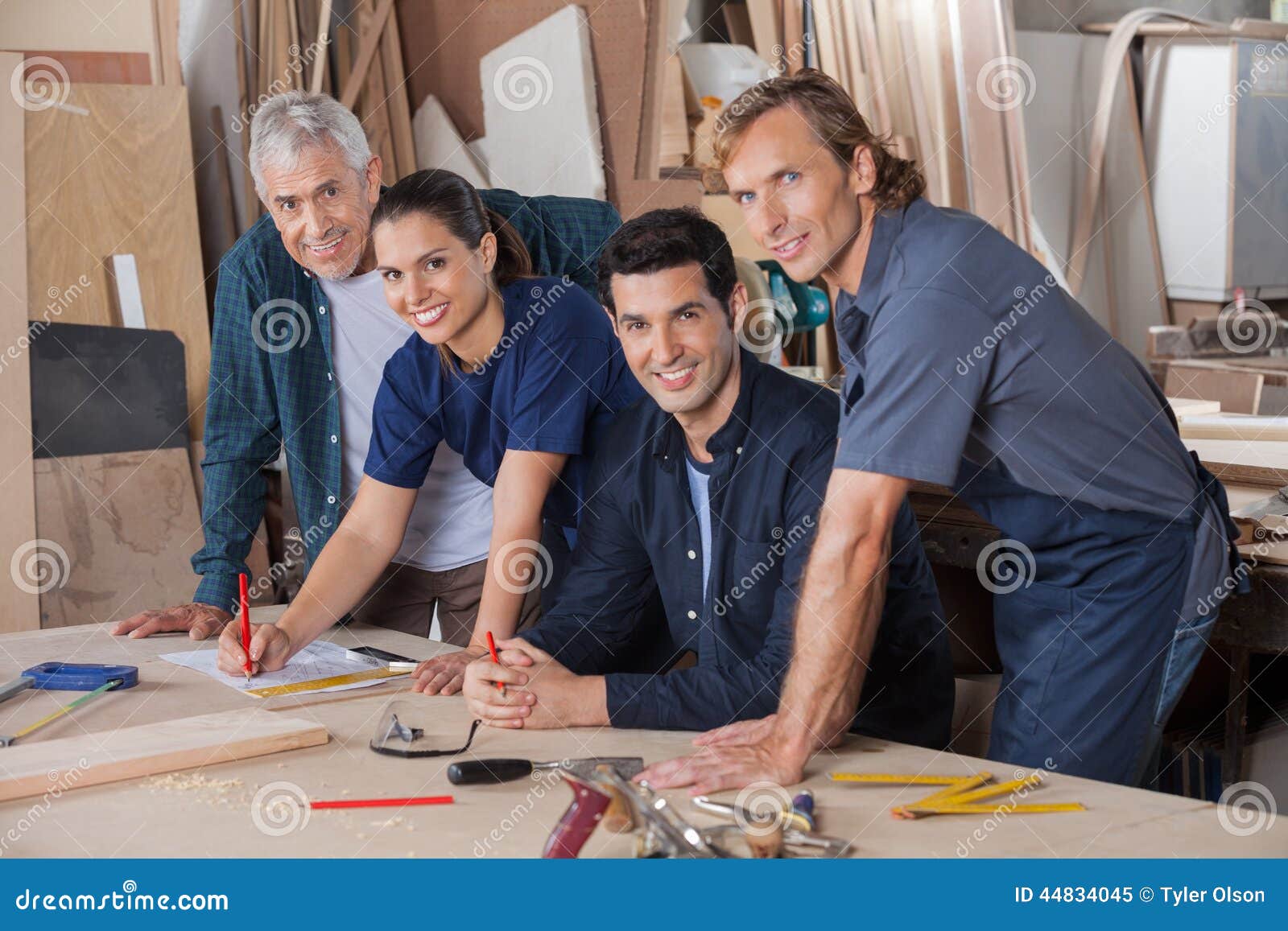 Confident Carpenters Working at Table in Workshop Stock Image - Image ...