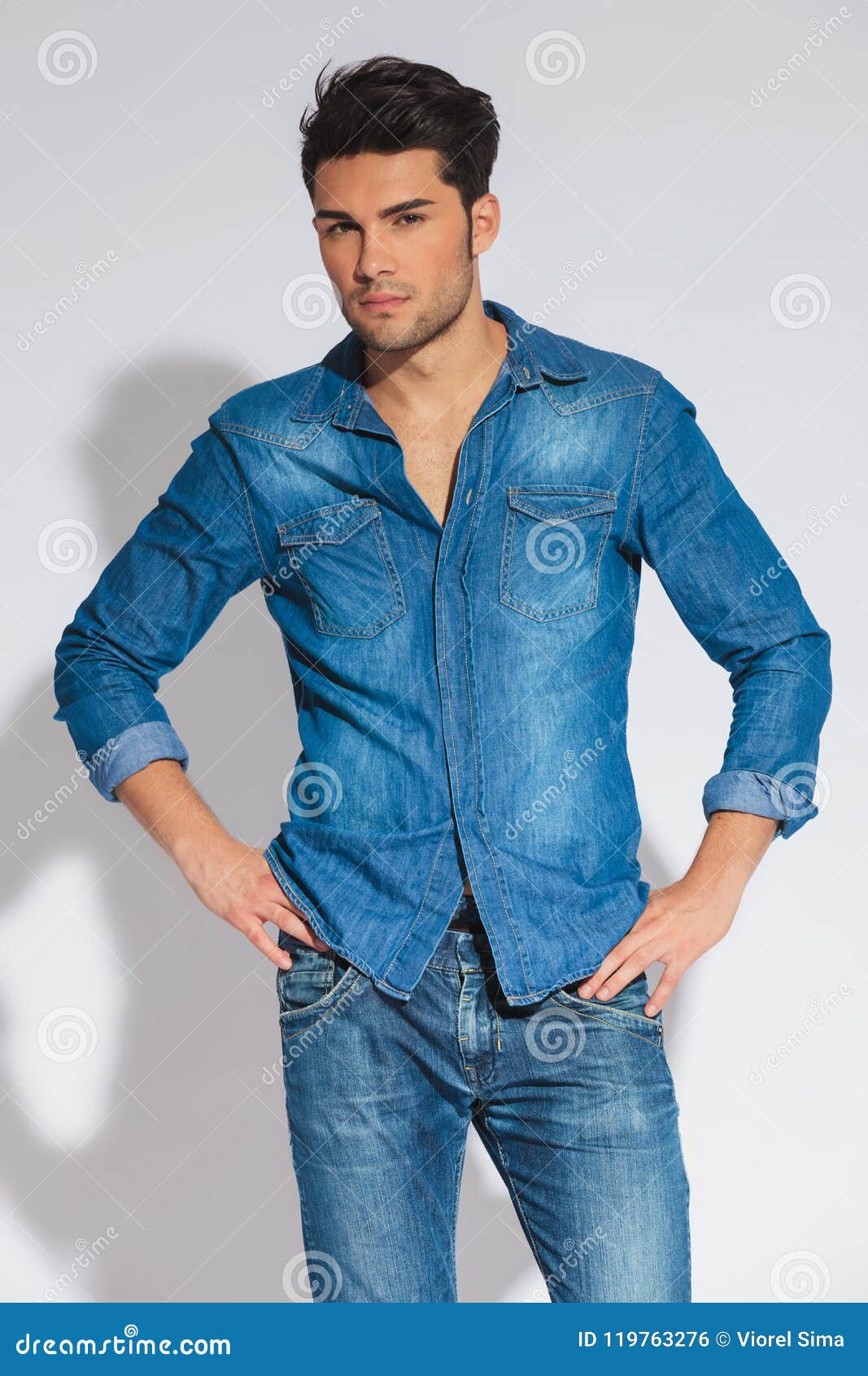 Confident Casual Man Standing With Hands On Hips Stock Photo - Image of ... Confident Casual Man Standing With Hands On Hips Stock Photo - Image of ...
