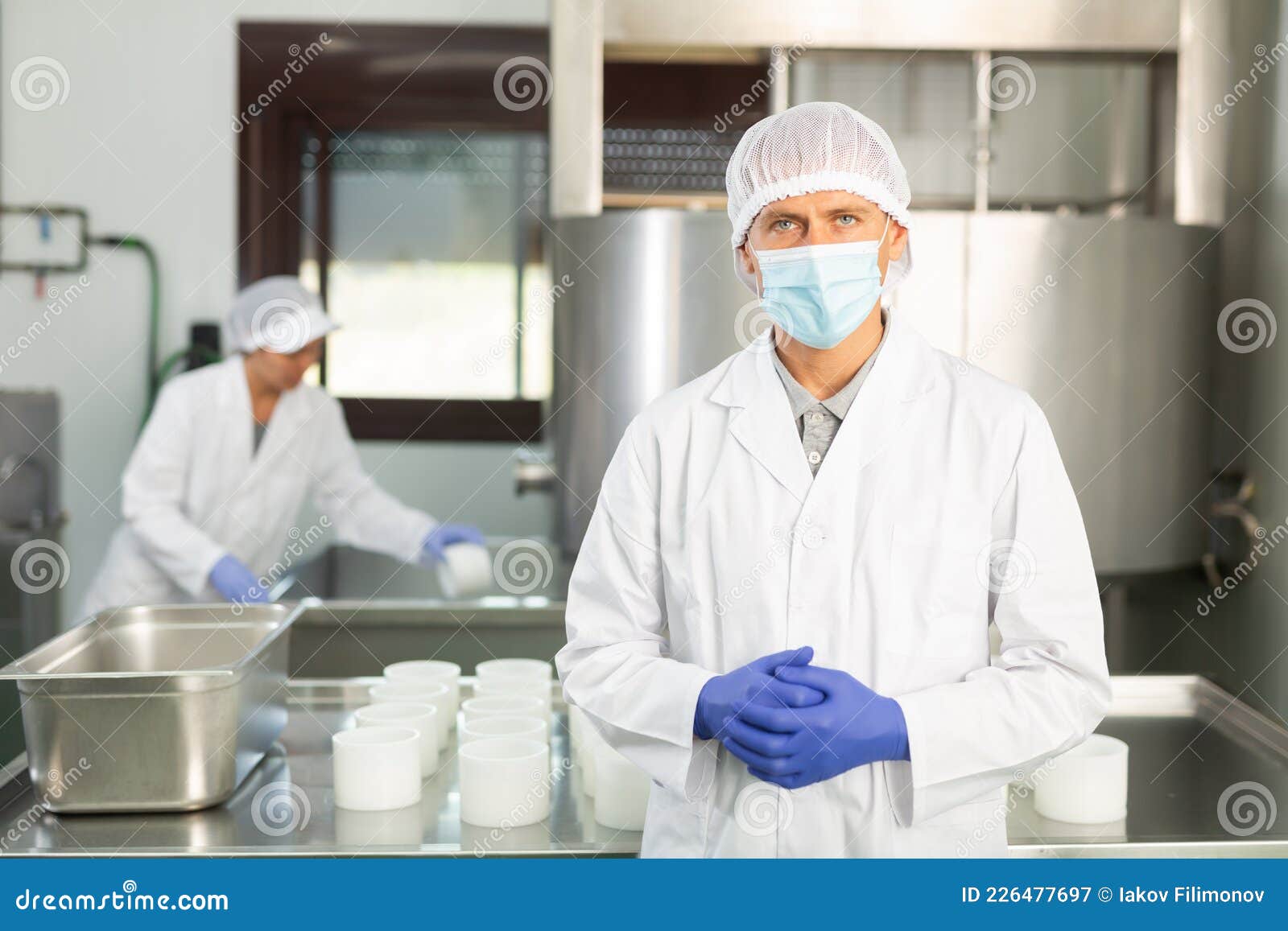 Confident Cheesemaker in Mask Standing in Cheese Shaping Workshop Stock ...