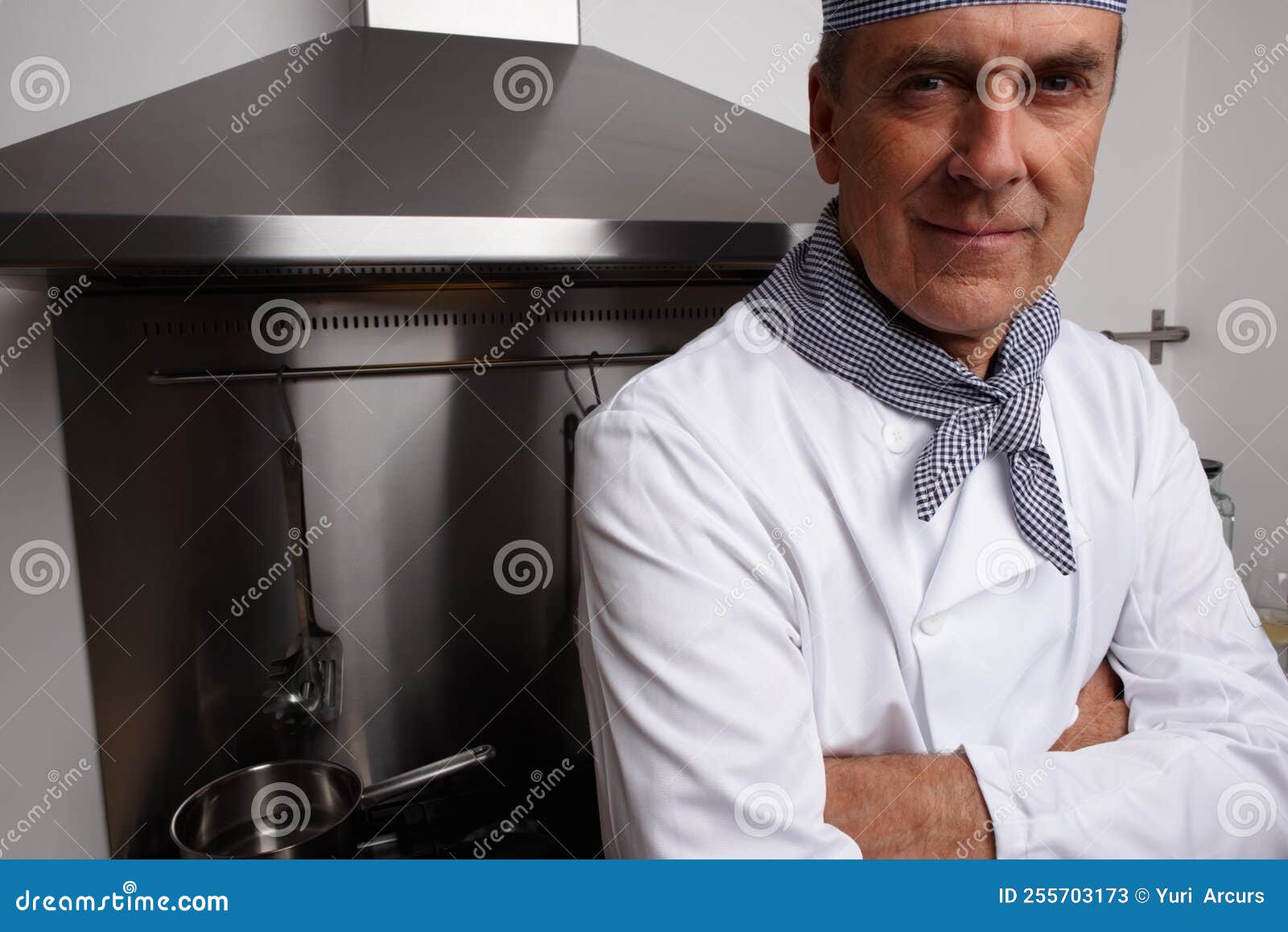 Confident Chef with Hands Folded in the Kitchen. Closeup Portrait of a ...
