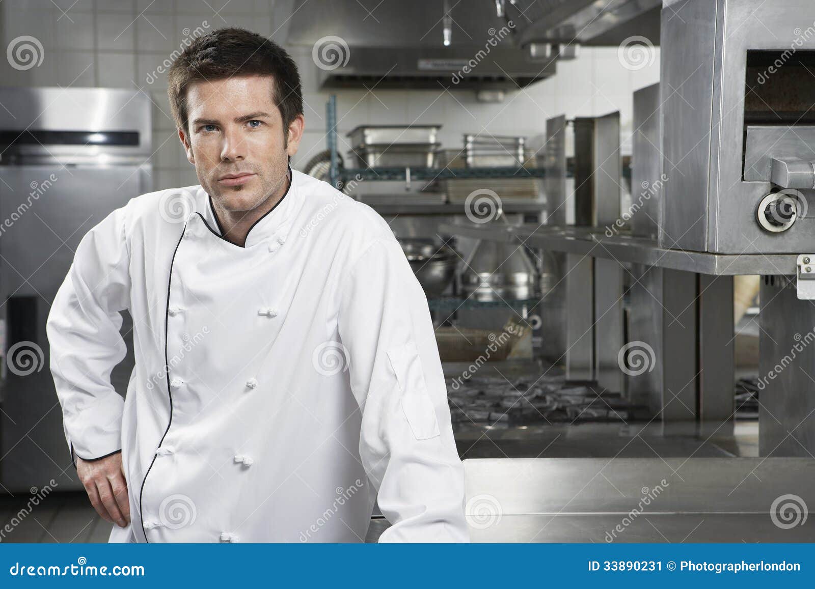 Confident Chef in Kitchen stock image. Image of cook - 33890231