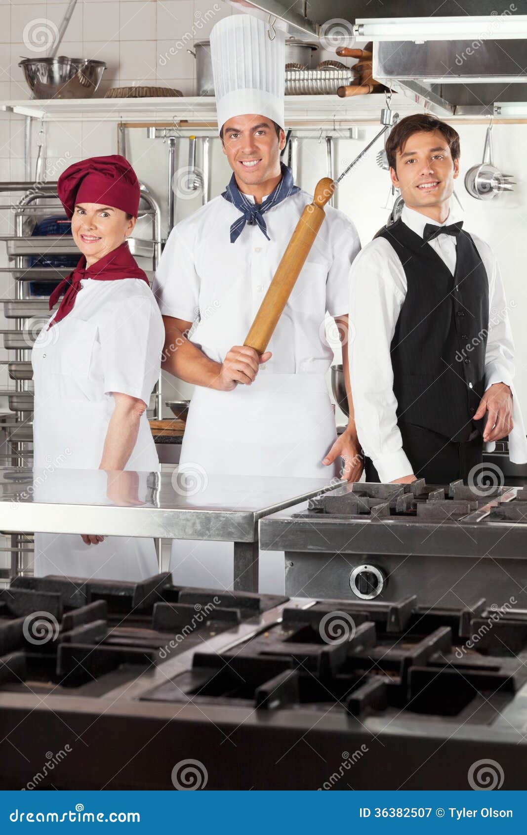 Confident Chefs and Waiter in Kitchen Stock Image - Image of formal ...