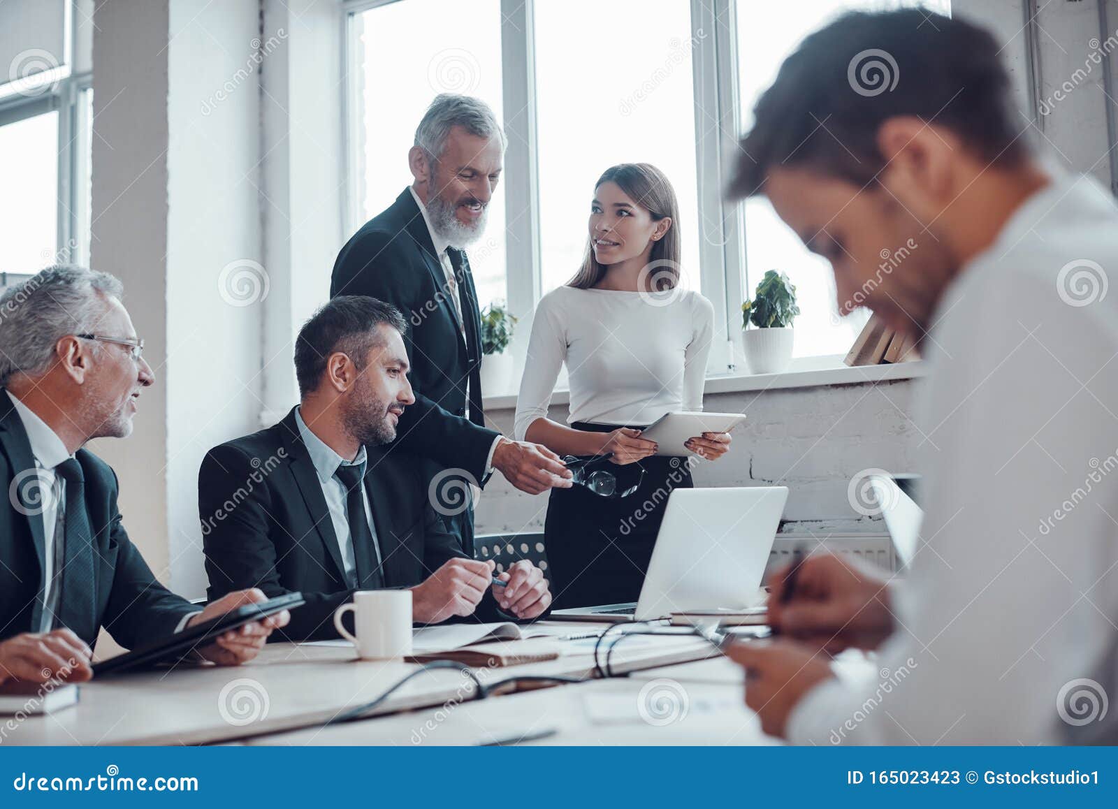Confident Colleagues Discussing Next Business Step Stock Image - Image ...
