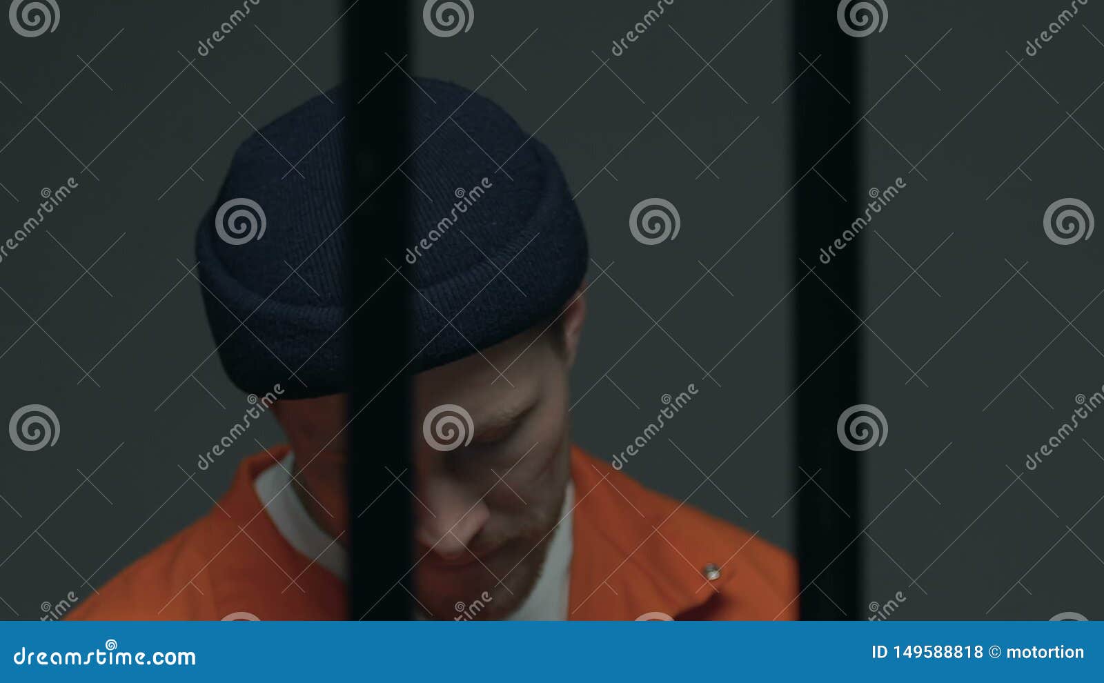 Confident Criminal with Scars on Face Looking at Camera Behind Prison ...