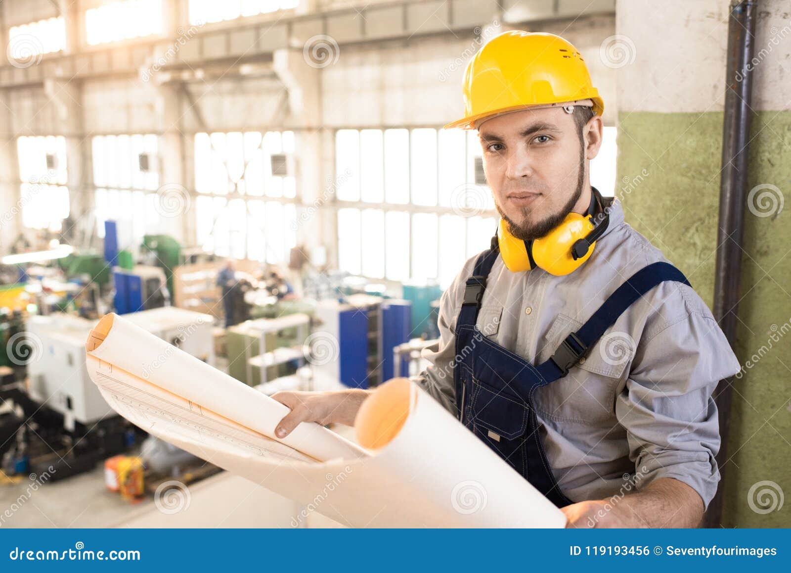 Confident Engineer Analyzing Blueprint Stock Photo - Image of person ...