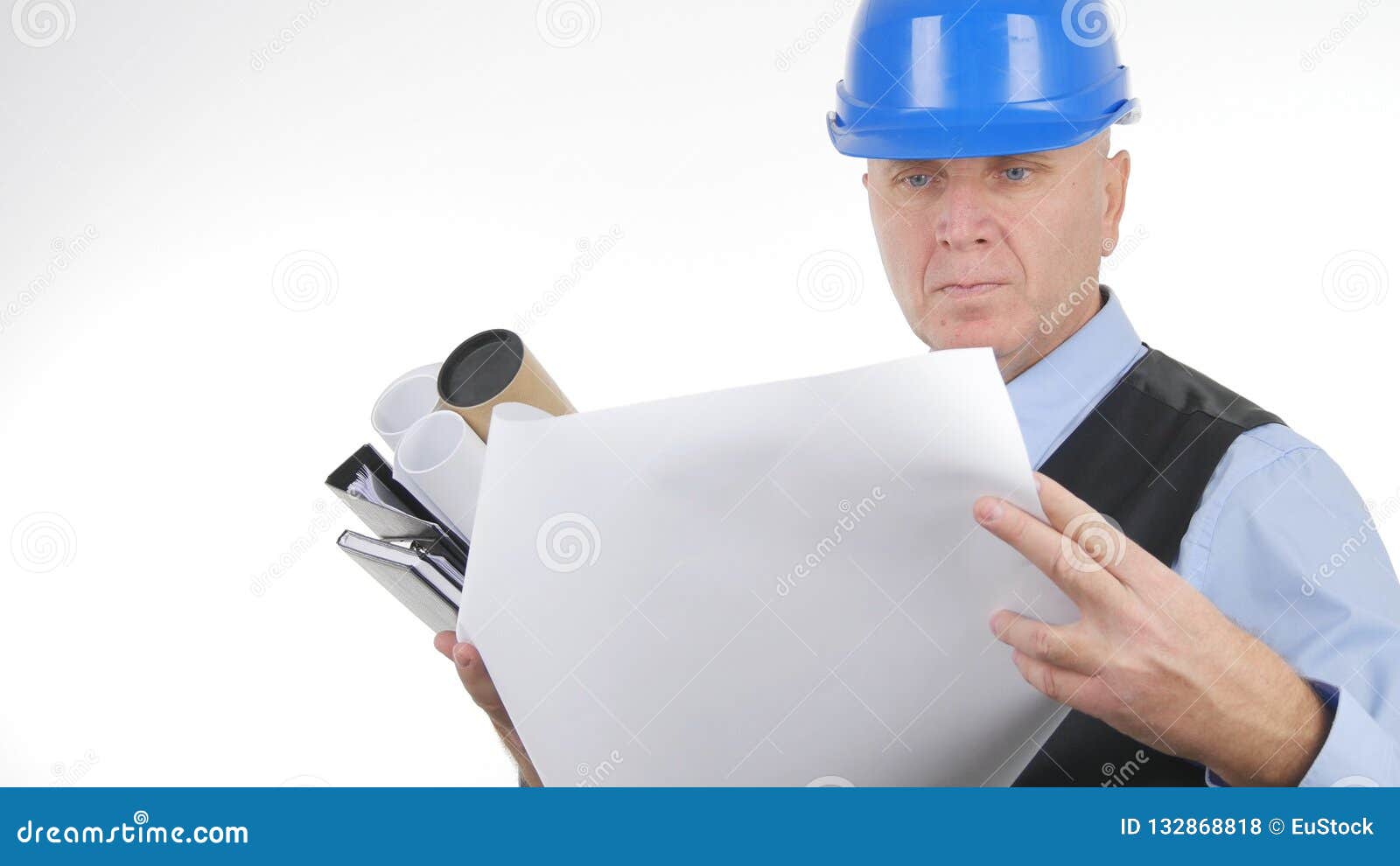 Confident Engineer Reading Technical Plans on White Background Stock ...