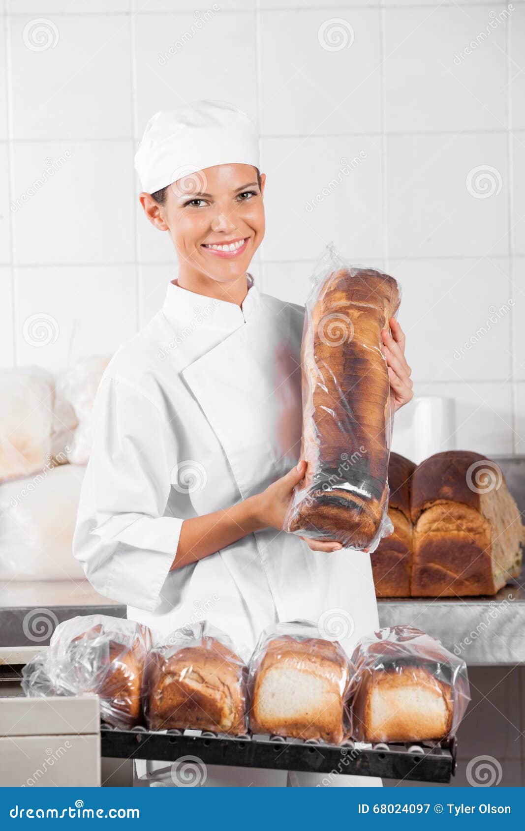 Confident Female Baker Showing Packed Breads Stock Image - Image of ...
