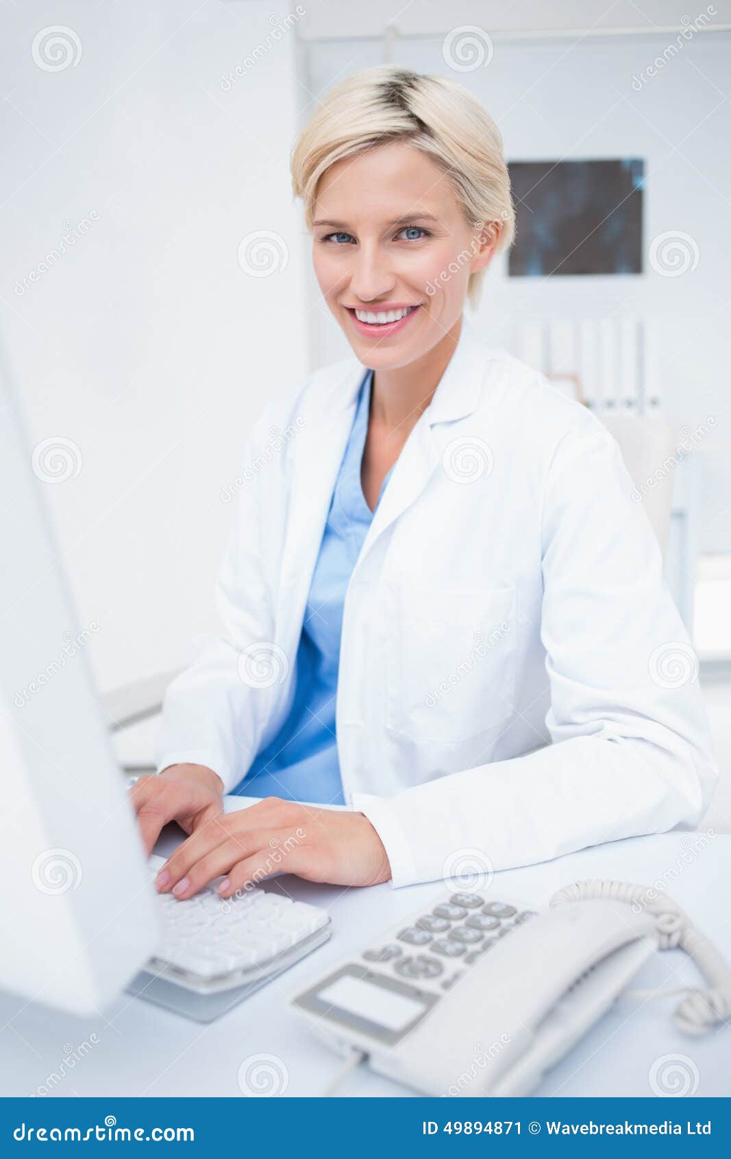 Confident Female Doctor Using Computer in Clinic Stock Image - Image of ...