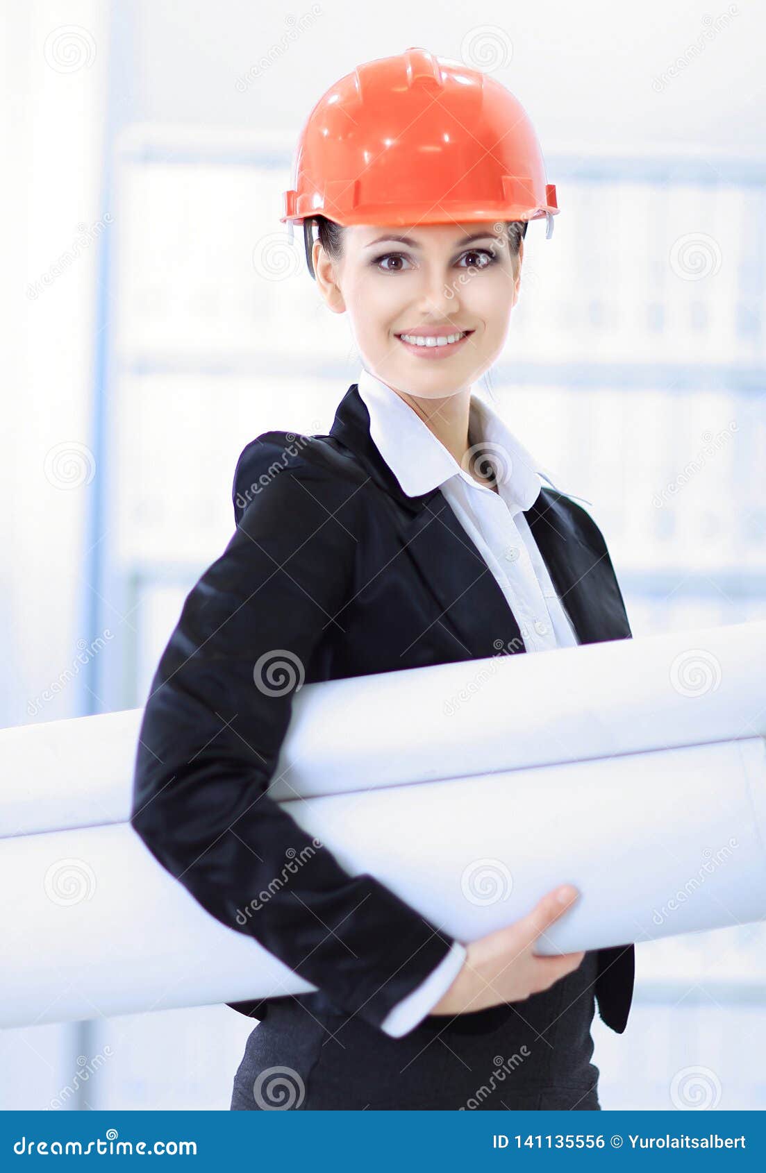 Confident Female Engineer with Blueprints in the Background of the ...