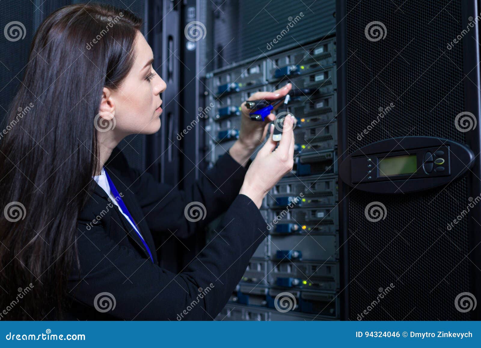 Confident Female Technician Looking at the USB Cables Stock Photo ...
