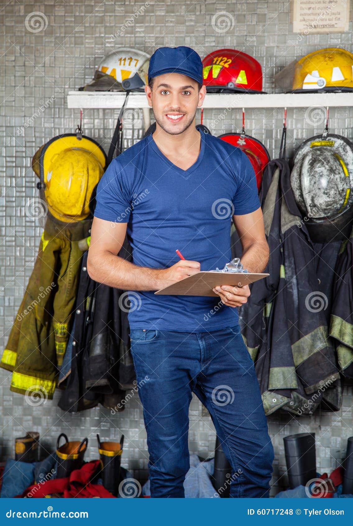 Confident Firefighter Holding Clipboard at Fire Stock Photo - Image of ...