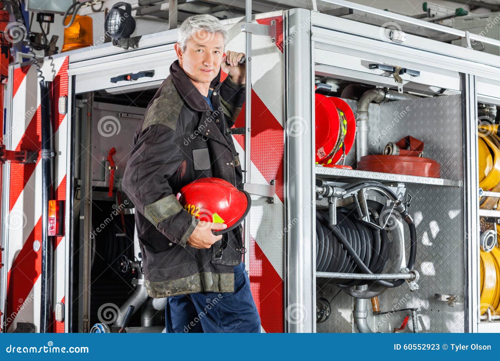 Confident Fireman Standing on Fire Engine Stock Image - Image of ...