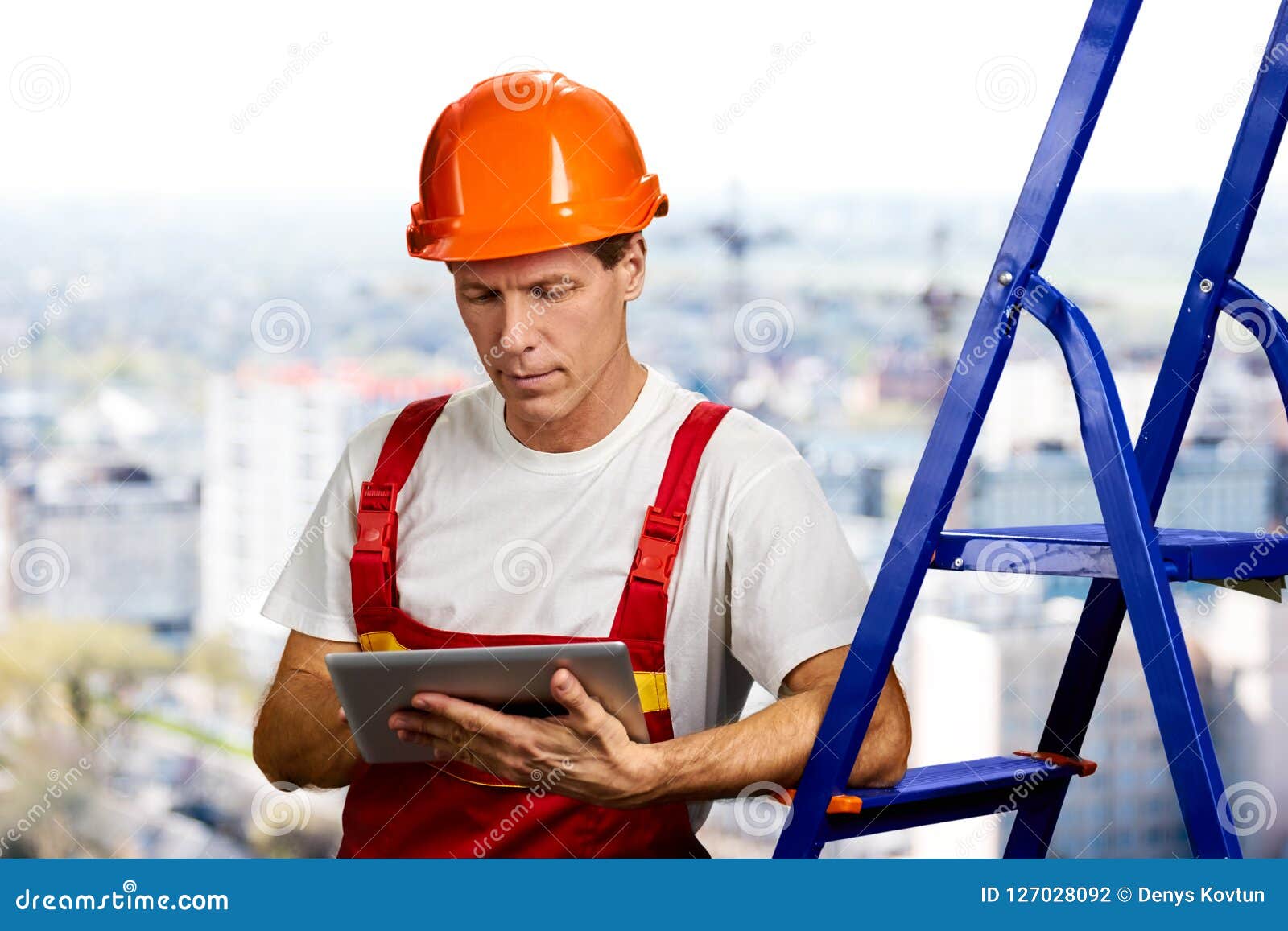 Confident Foreman Working on Digital Tablet. Stock Photo - Image of ...