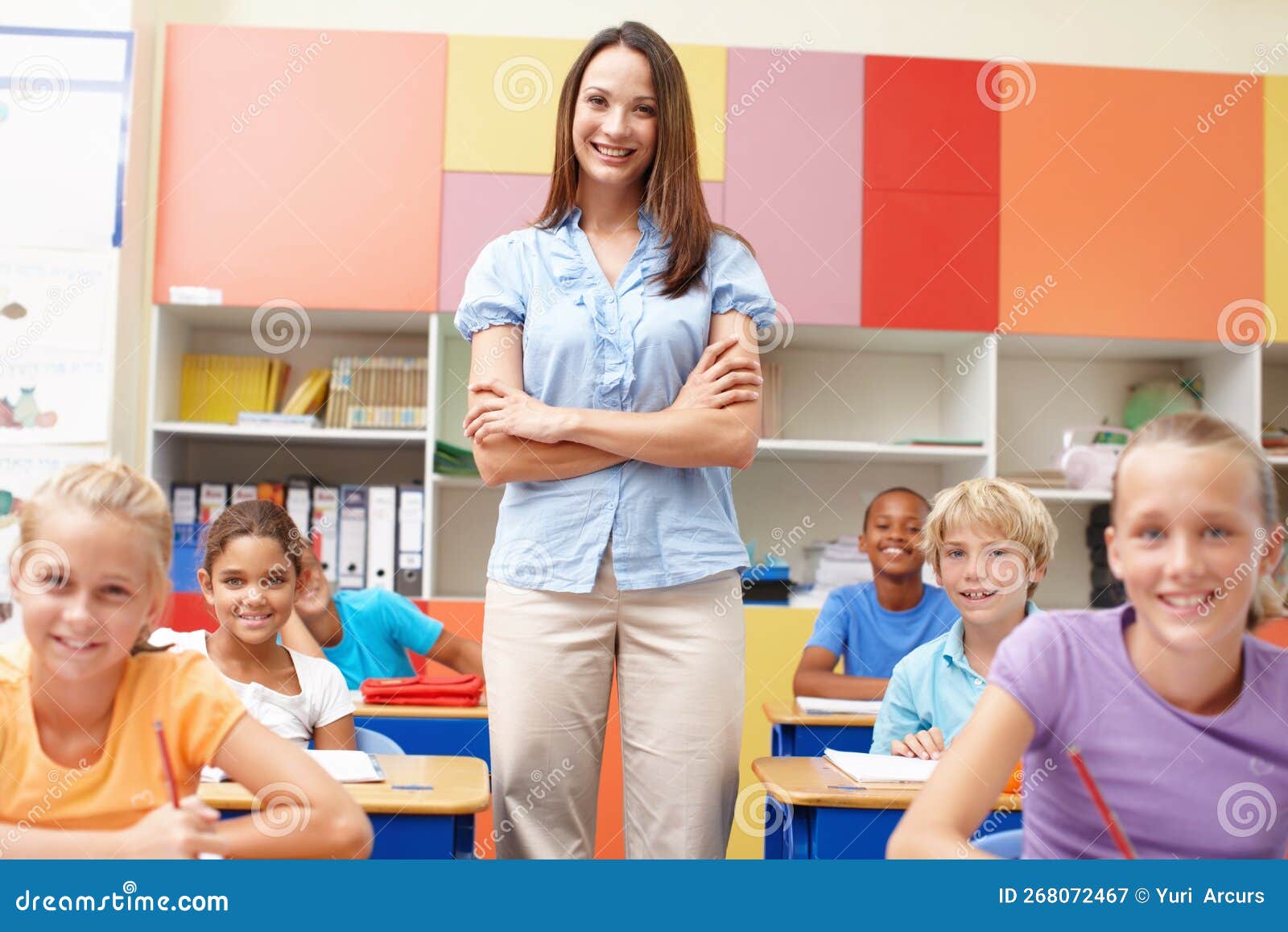 Confident in Her Teaching Ability. a Beautiful Young Teacher Standing ...