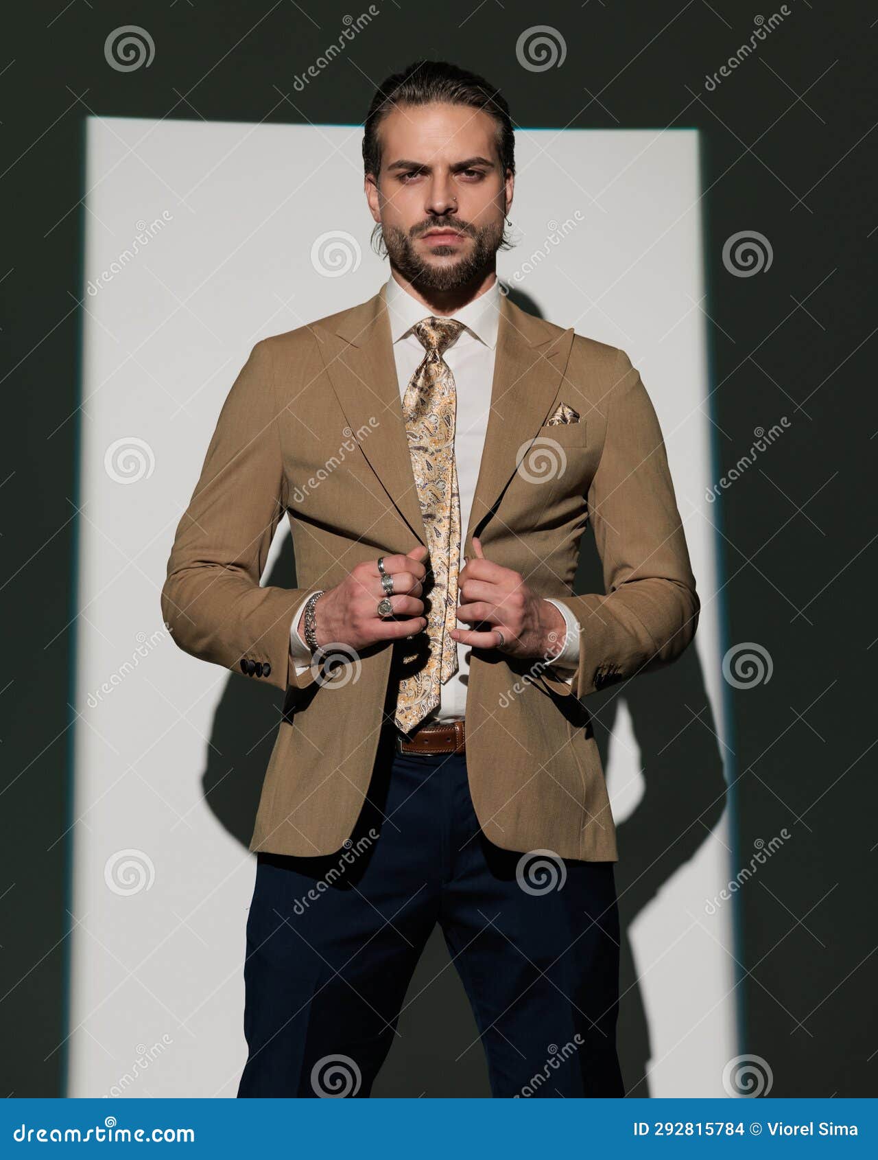 Confident High Class Man Looking Forward and Closing Brown Suit Stock ...