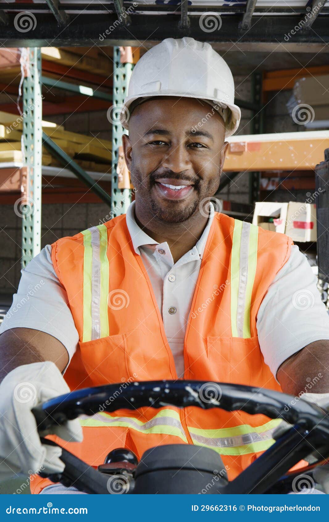 Confident Industrial Worker Driving Forklift at Workplace Stock Photo ...
