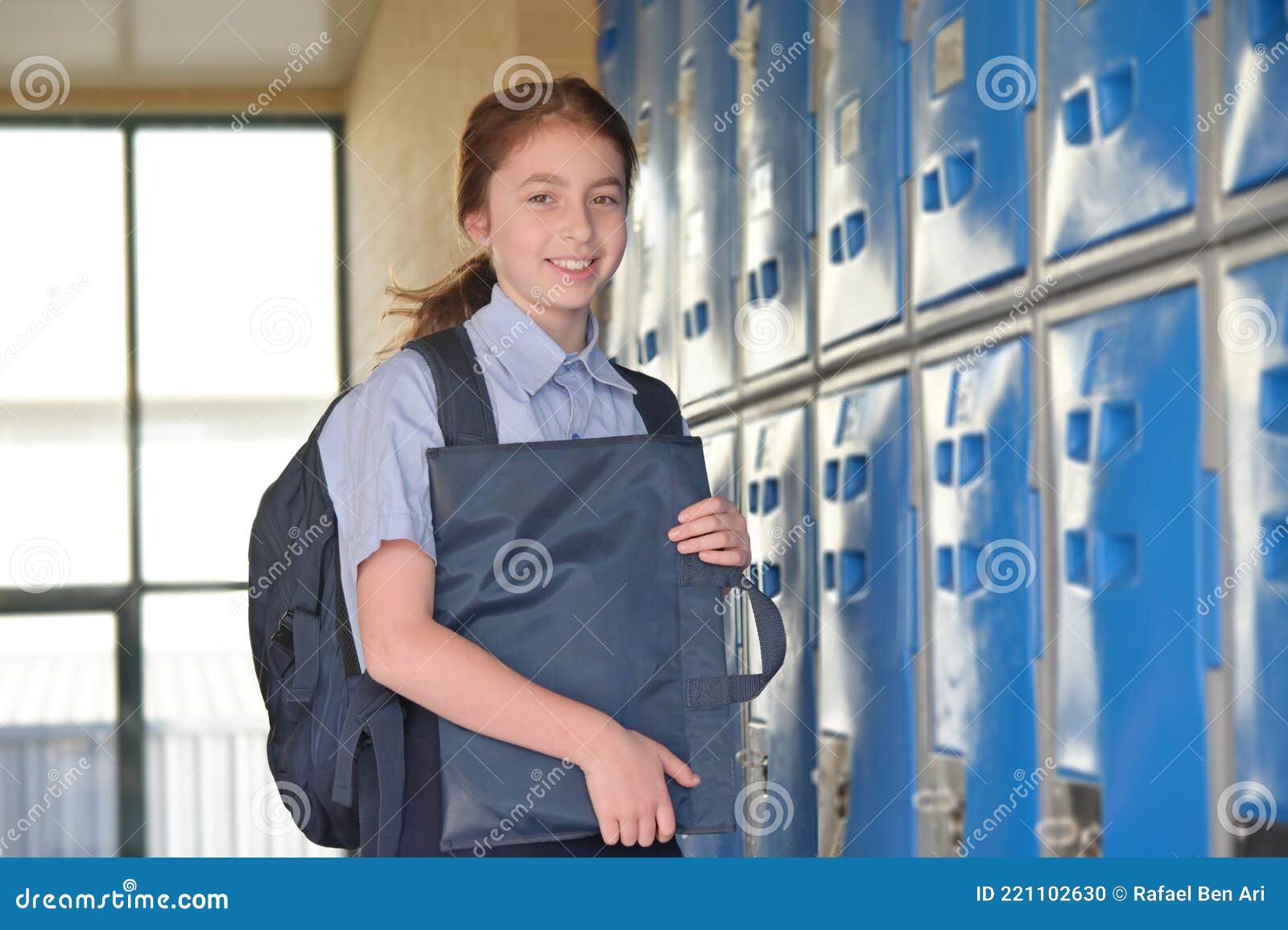 Confident Intermediate High School Student Standing by Lockers Stock ...