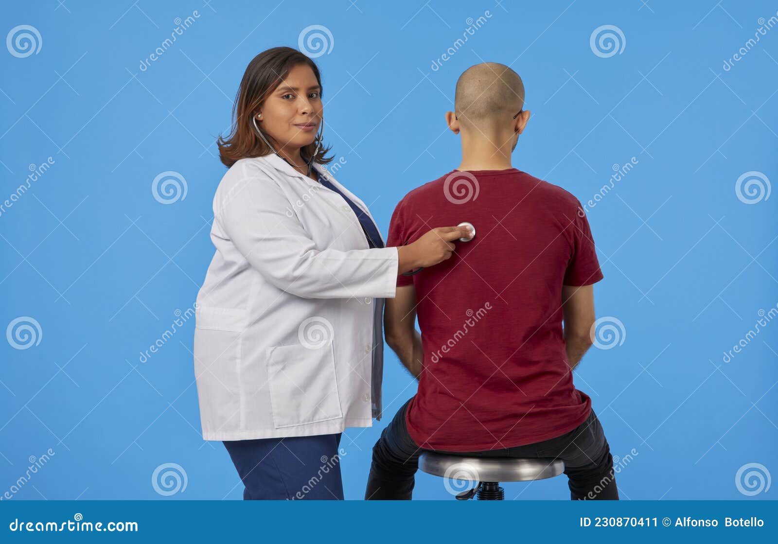 Confident Internist Woman Using Stethoscope On Back Of Unrecognizable ...