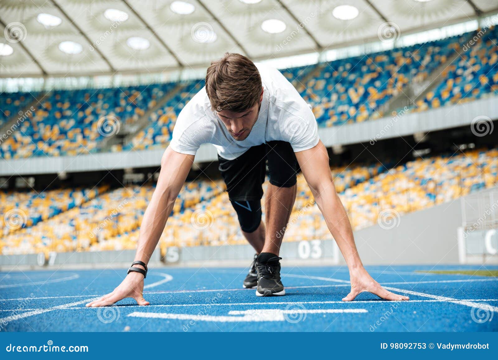 Confident Male Athlete Standing in Starting Position Ready for Running ...