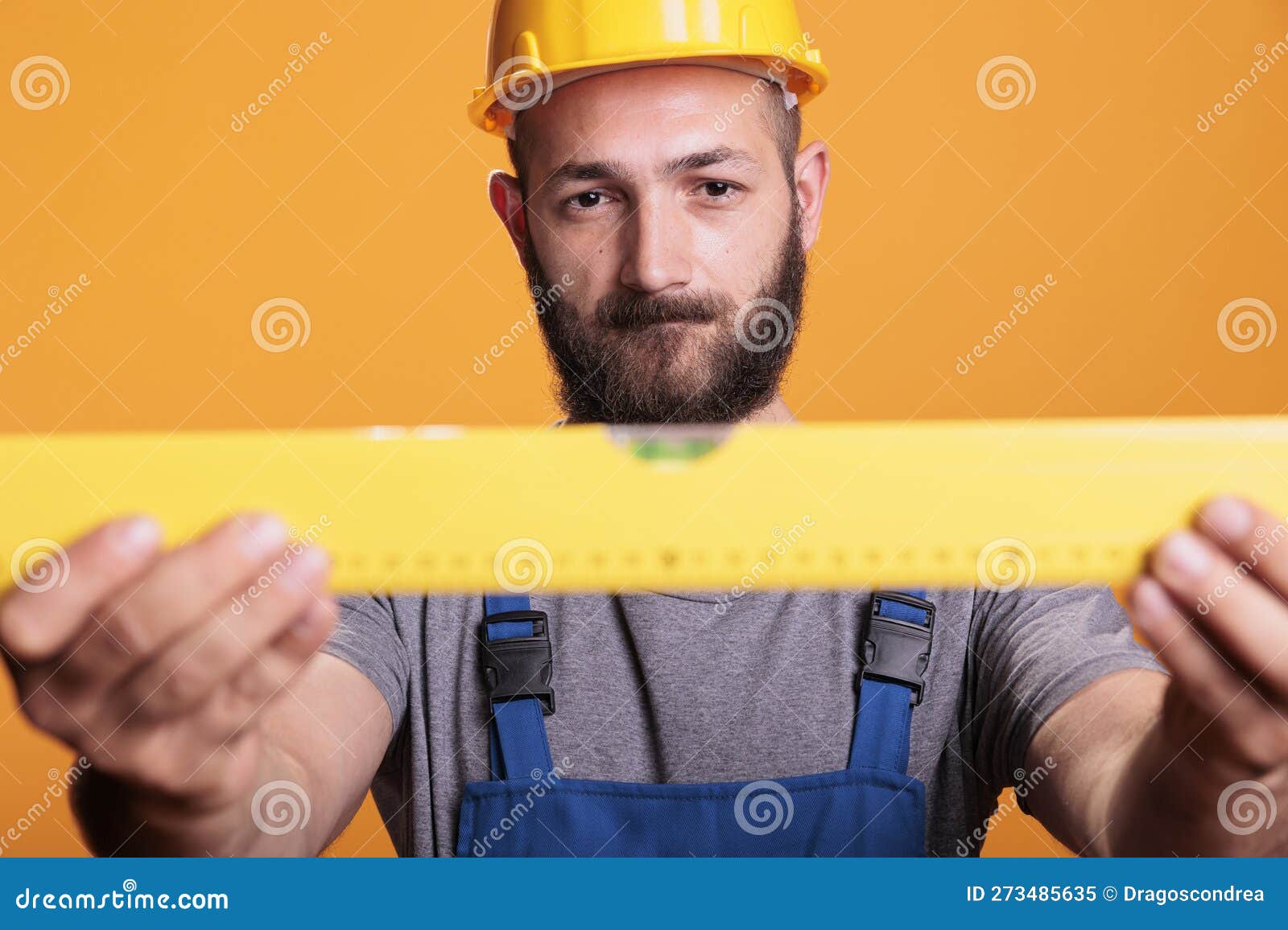Confident Male Carpenter Looking at Construction Leveler Stock Image ...