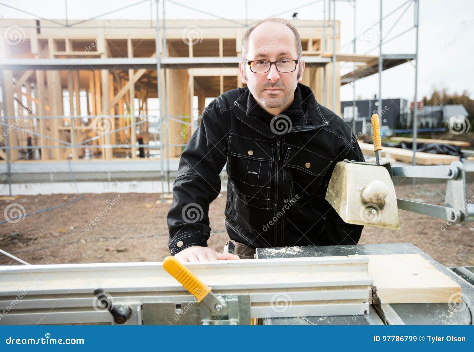 Confident Male Carpenter Using Table Saw To Cut Plank Stock Image ...