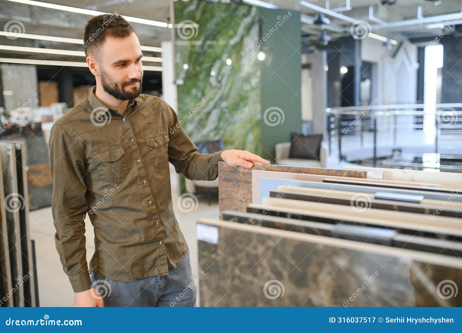 Confident Male Customer Picking Out Wall Tile Materials for Bathroom in ...