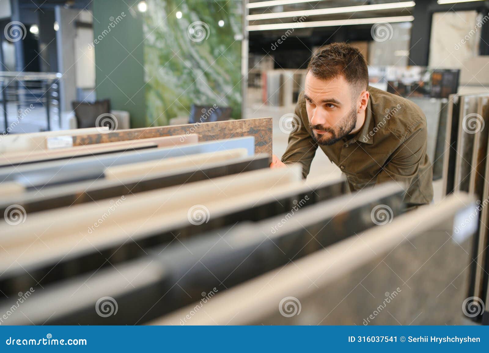 Confident Male Customer Picking Out Wall Tile Materials for Bathroom in ...