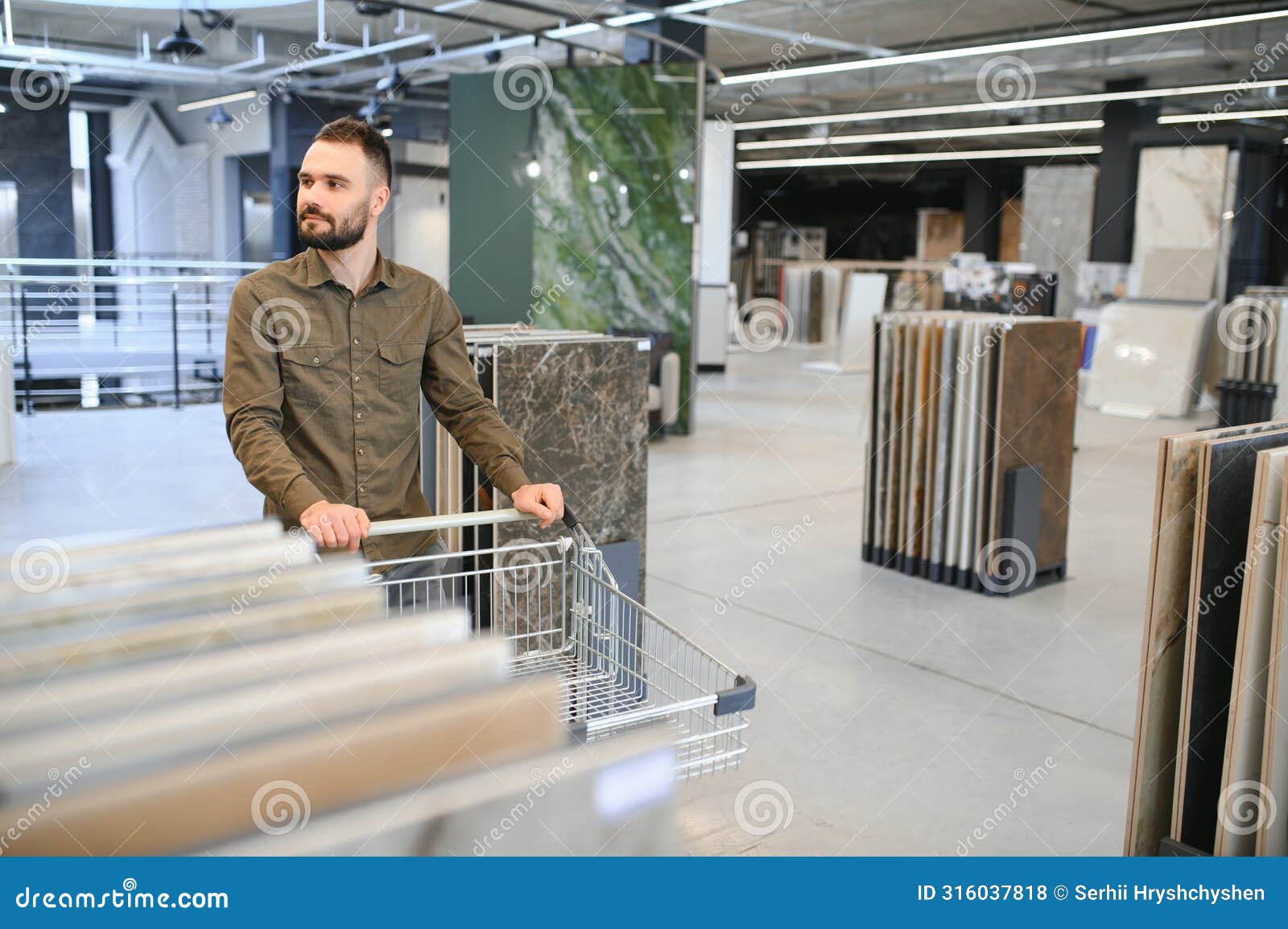 Confident Male Customer Picking Out Wall Tile Materials for Bathroom in ...