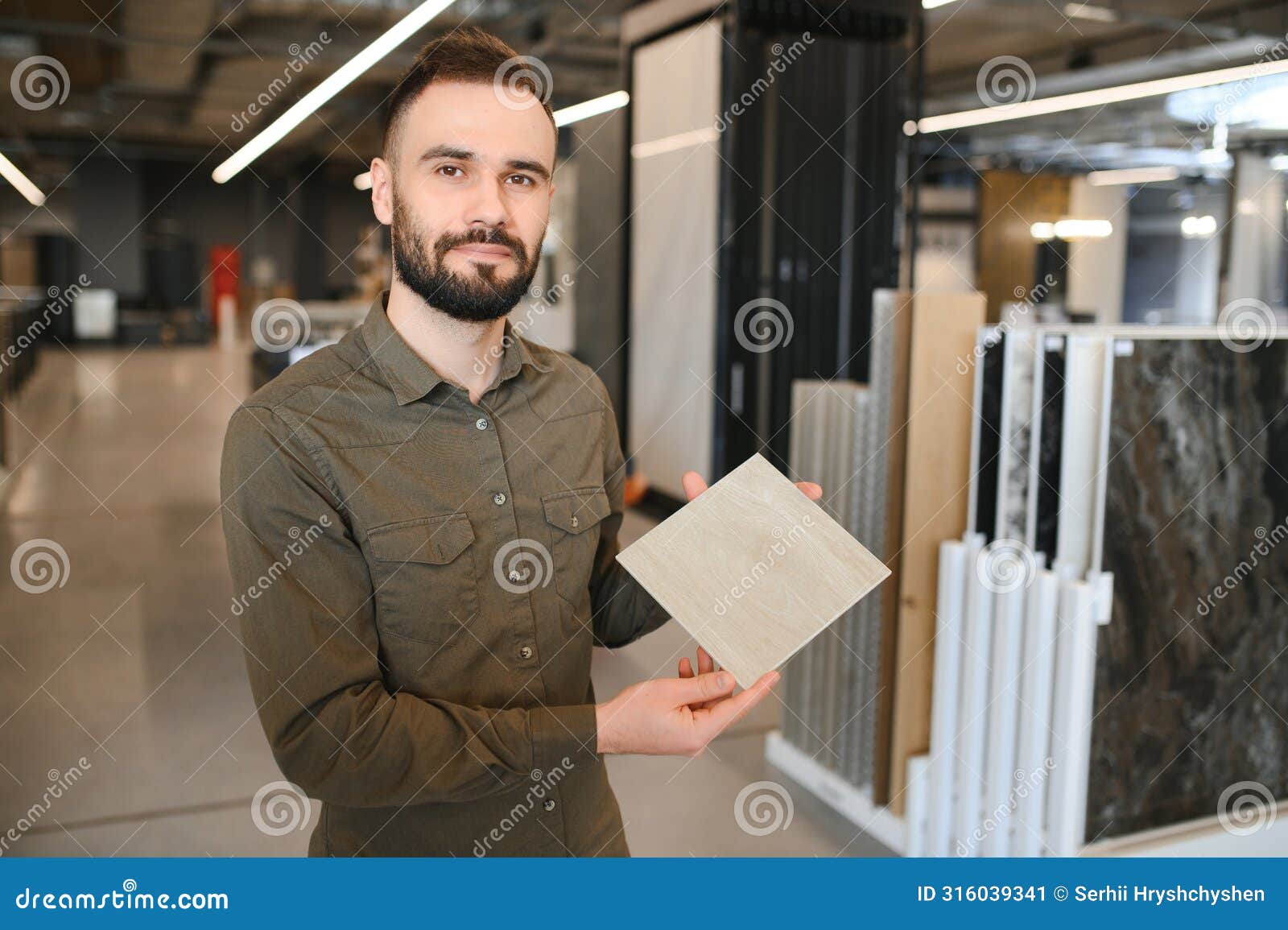 Confident Male Customer Picking Out Wall Tile Materials for Bathroom in ...
