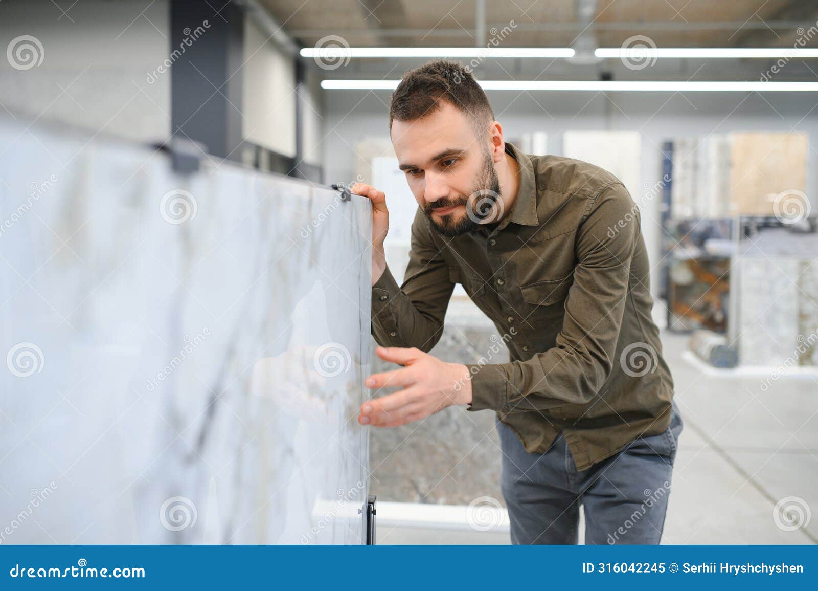 Confident Male Customer Picking Out Wall Tile Materials for Bathroom in ...