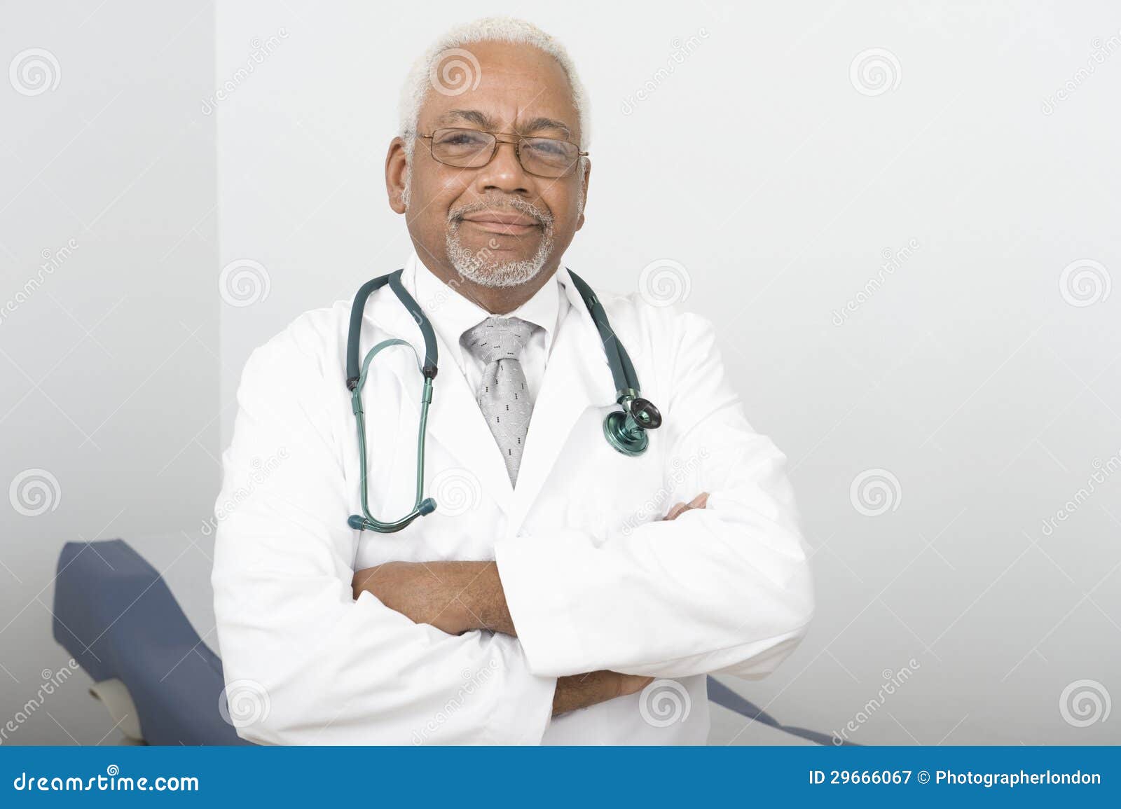 Confident Male Doctor Standing with Hands Folded Stock Image - Image of ...