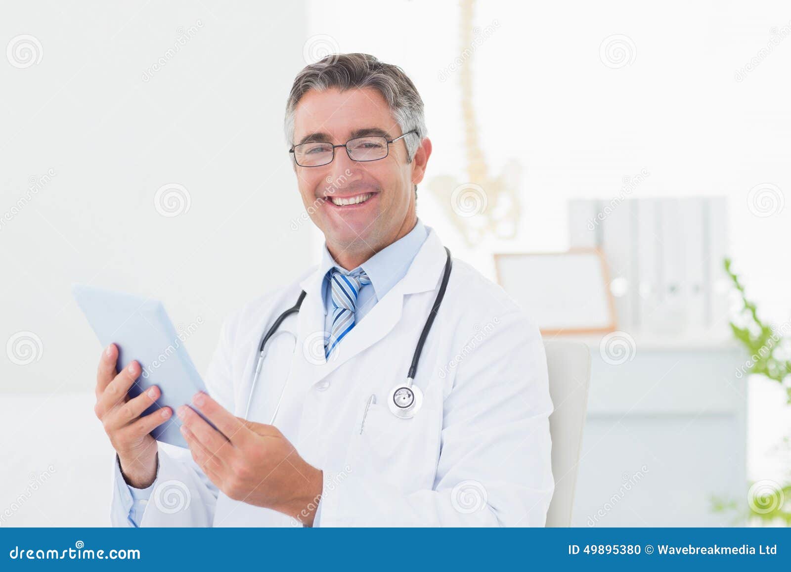 Confident Male Doctor Using Tablet Computer Stock Photo - Image of ...