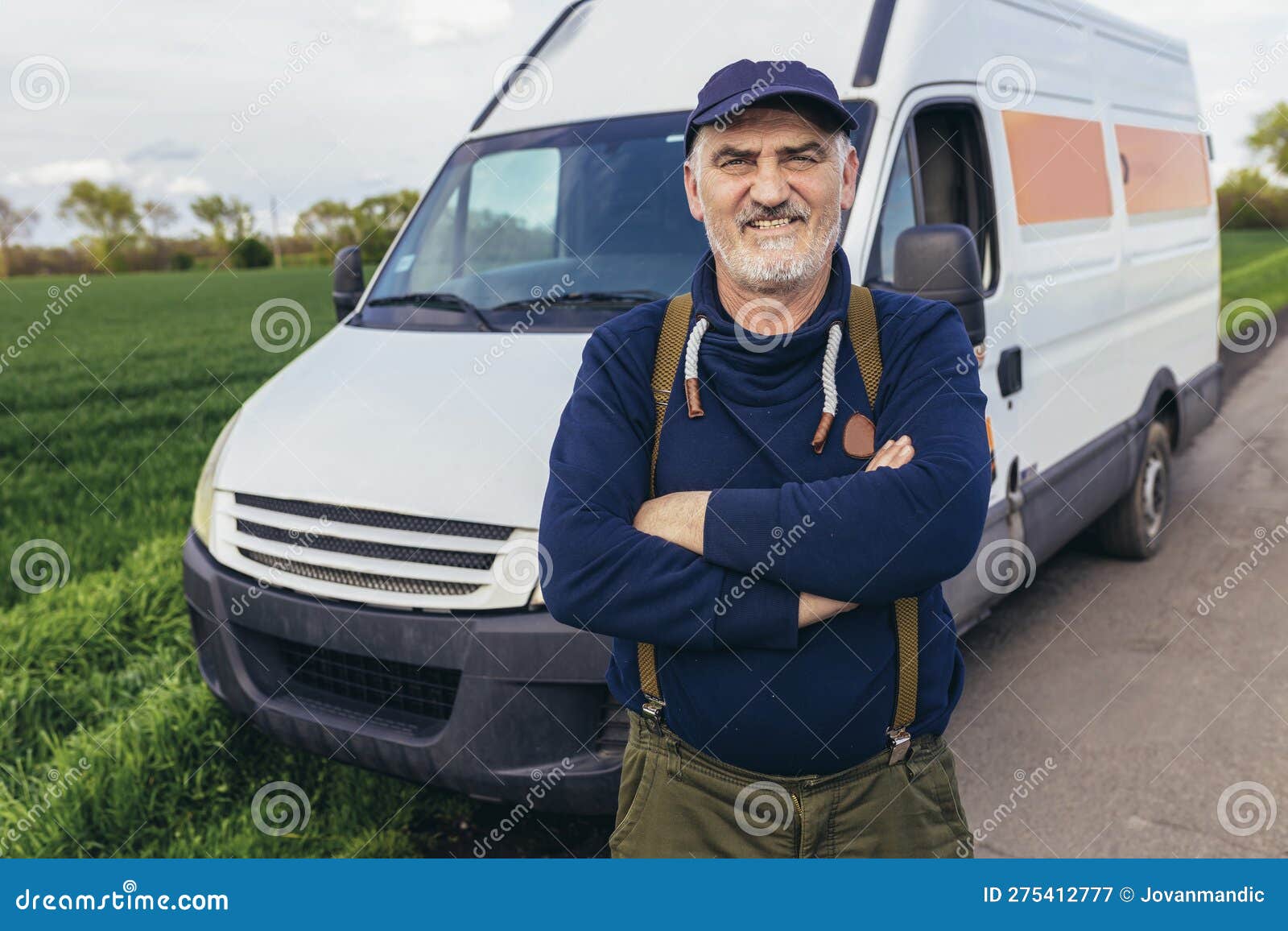 Confident Male Driver Standing in Front on His Van and Looking at ...