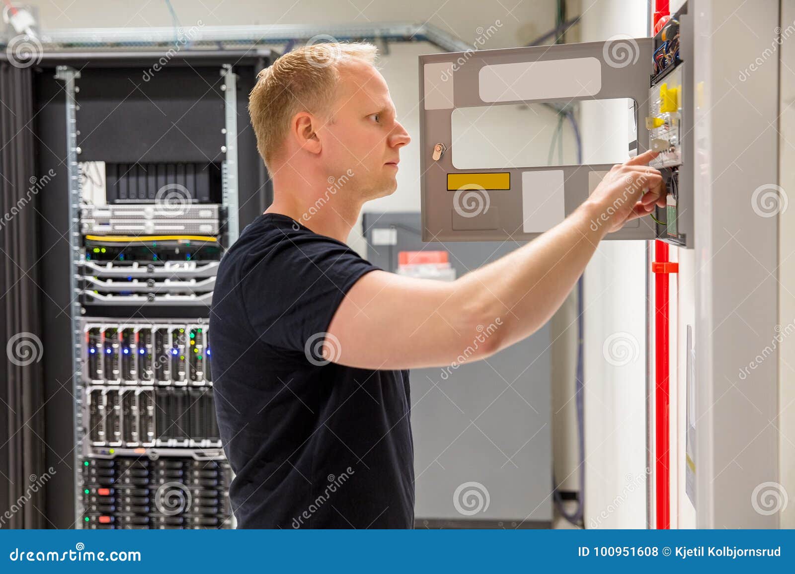 Confident Male Technician Checking Fire Panel in Datacenter Stock Photo ...