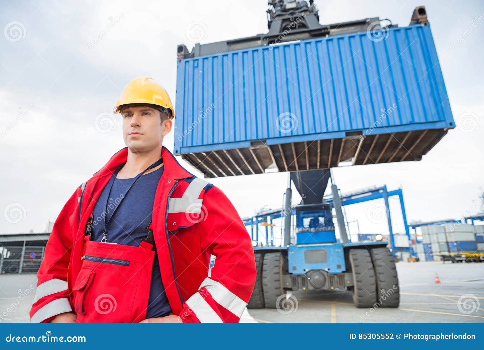 Confident Male Worker Standing in Front of Freight Vehicle at Shipyard ...